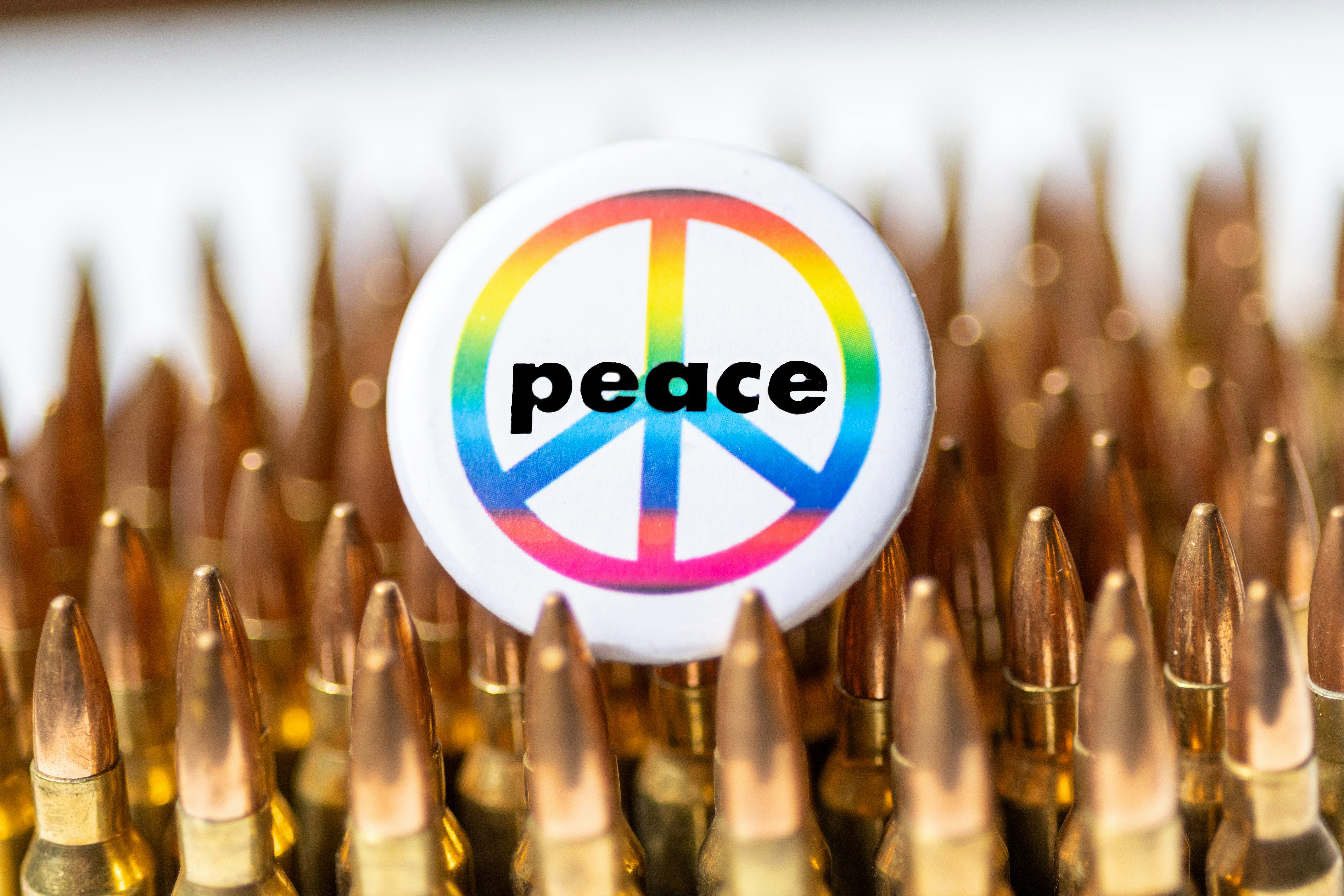 Peace Badge Rising Above Brass Spikes