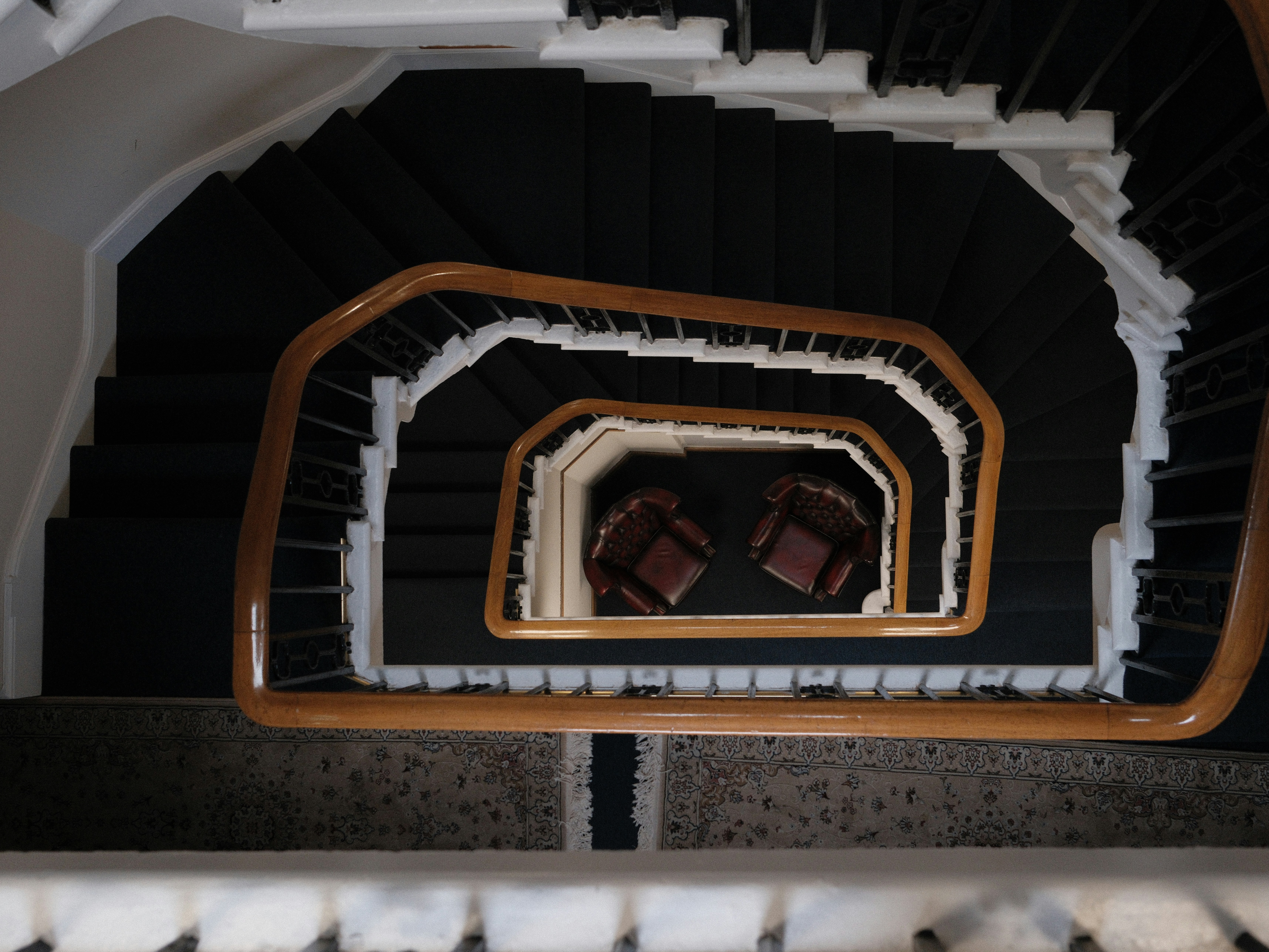 Spiral Descent: A Top-Down View into the Atrium Staircase