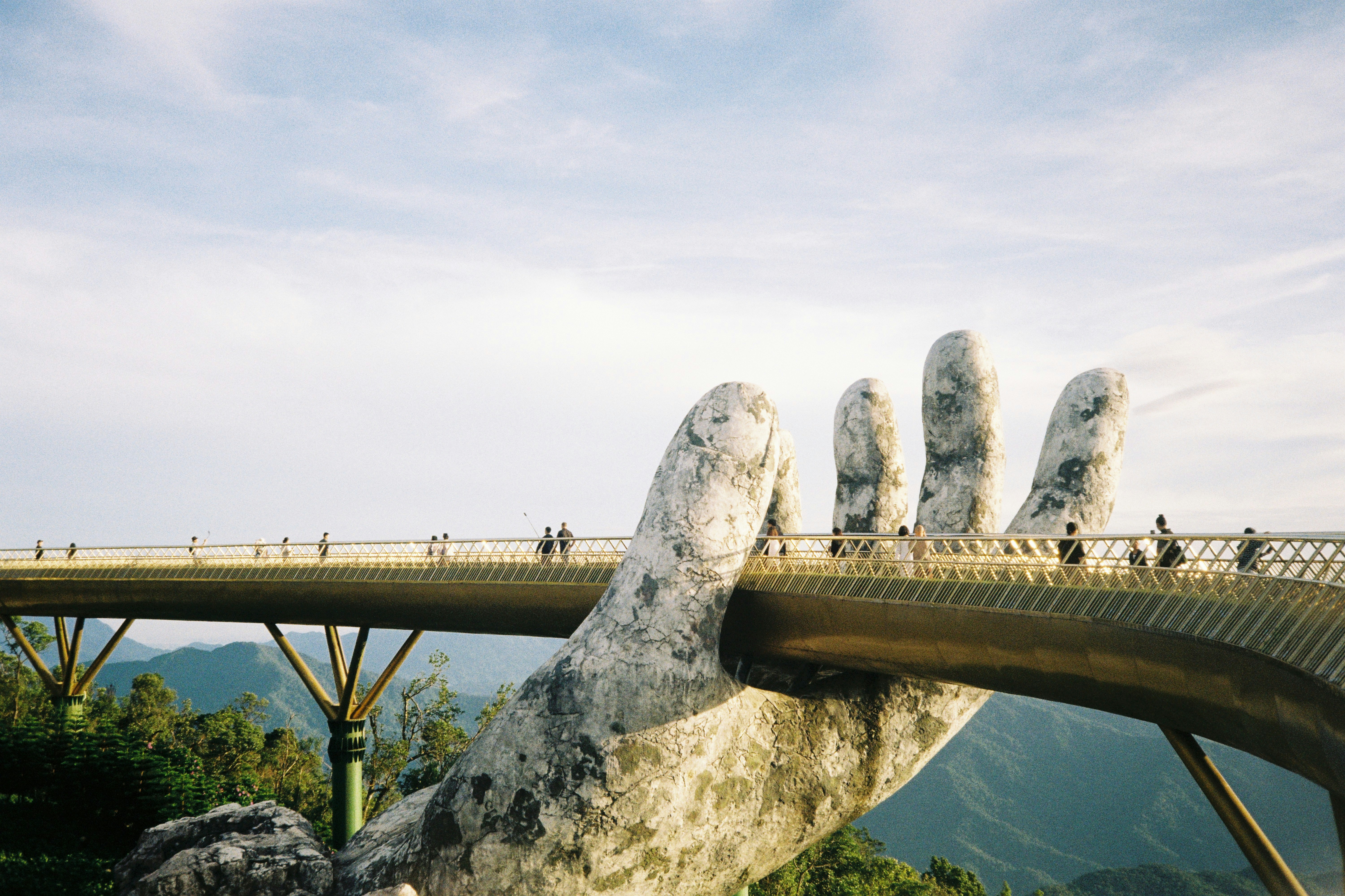 Giants of the Sky: A Clasped Bridge Over Stone Giants