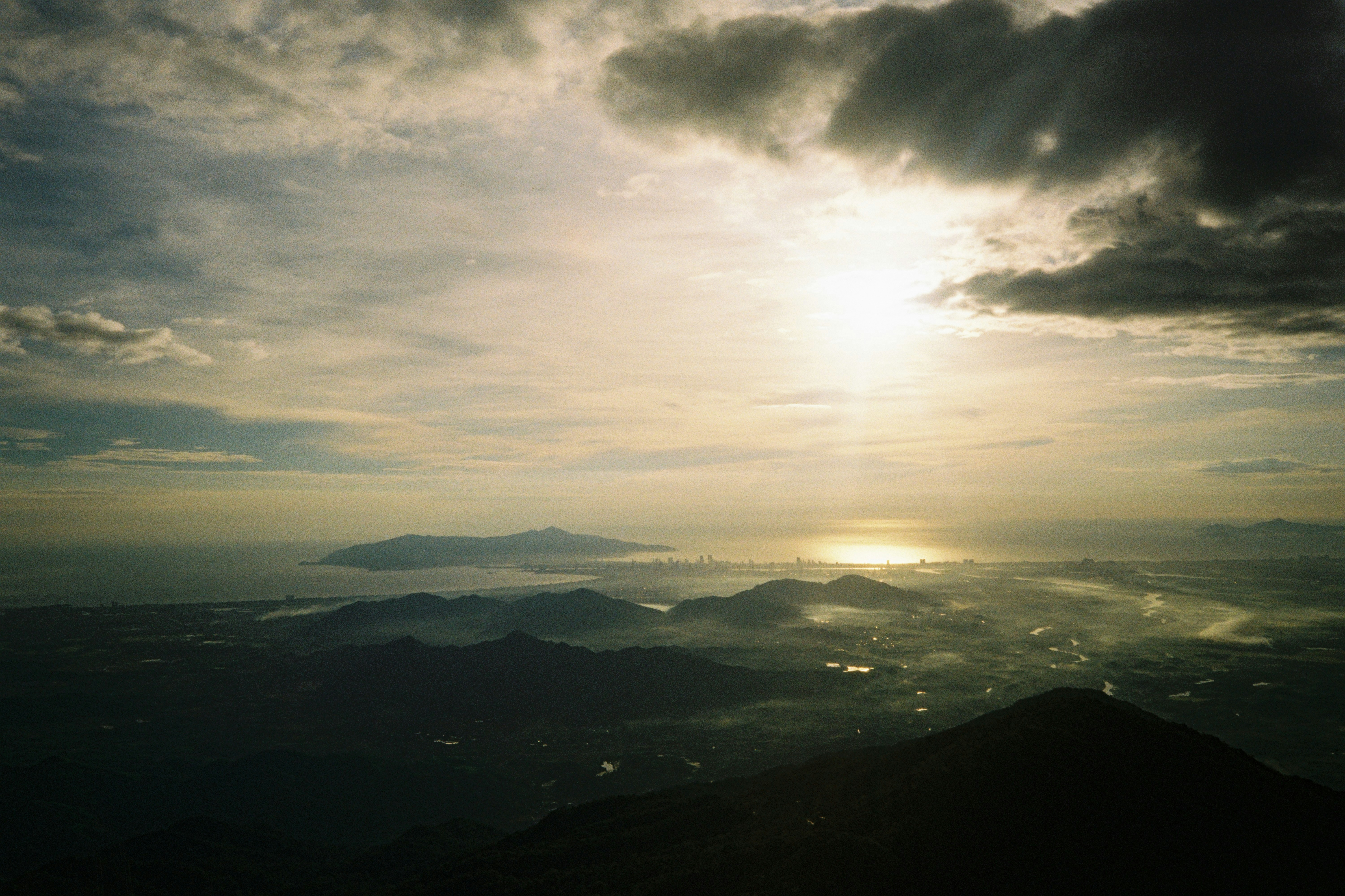 Sunlit Horizon Over Misty Valleys