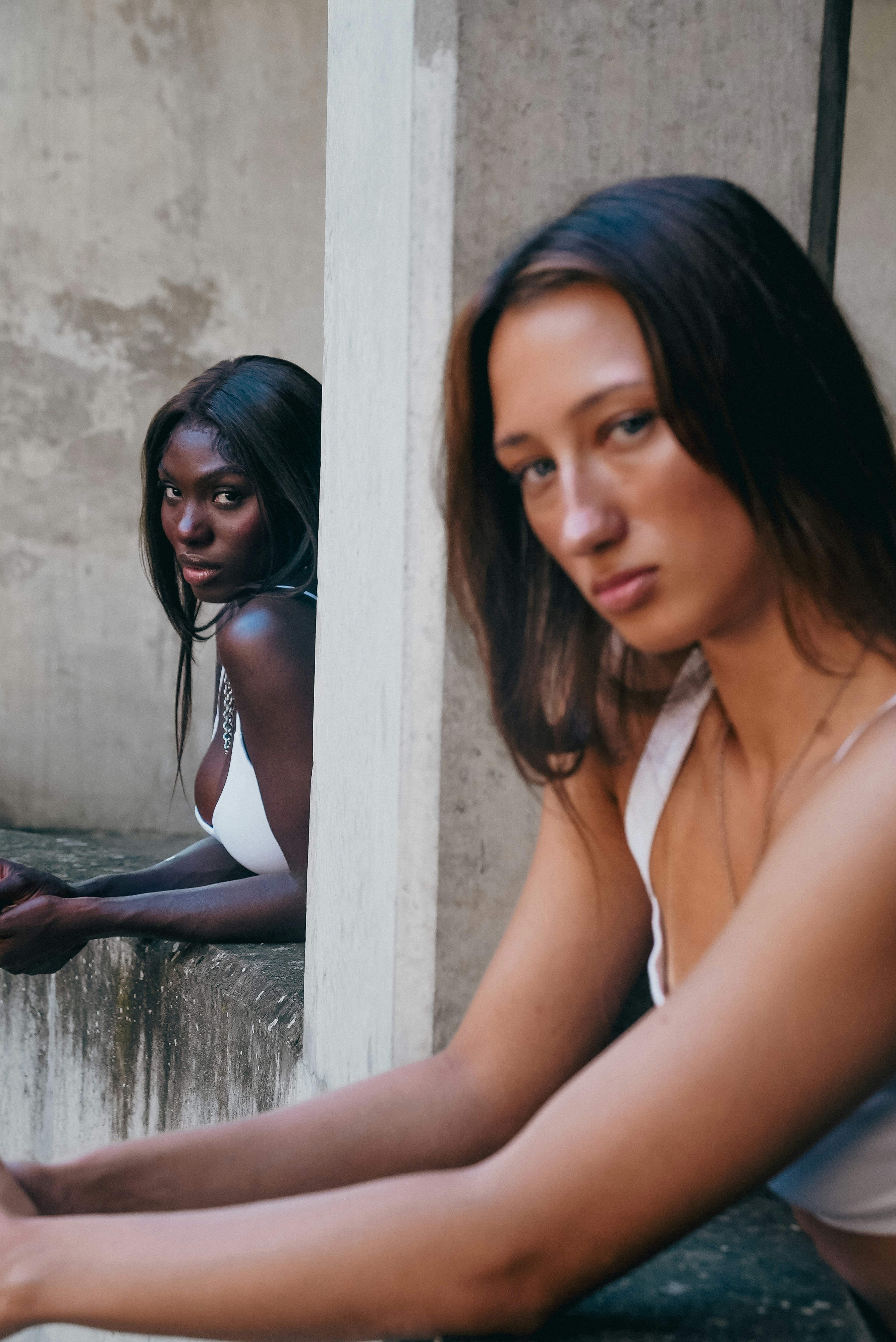 Two Silent Corners: Portraits Through Concrete Gaps