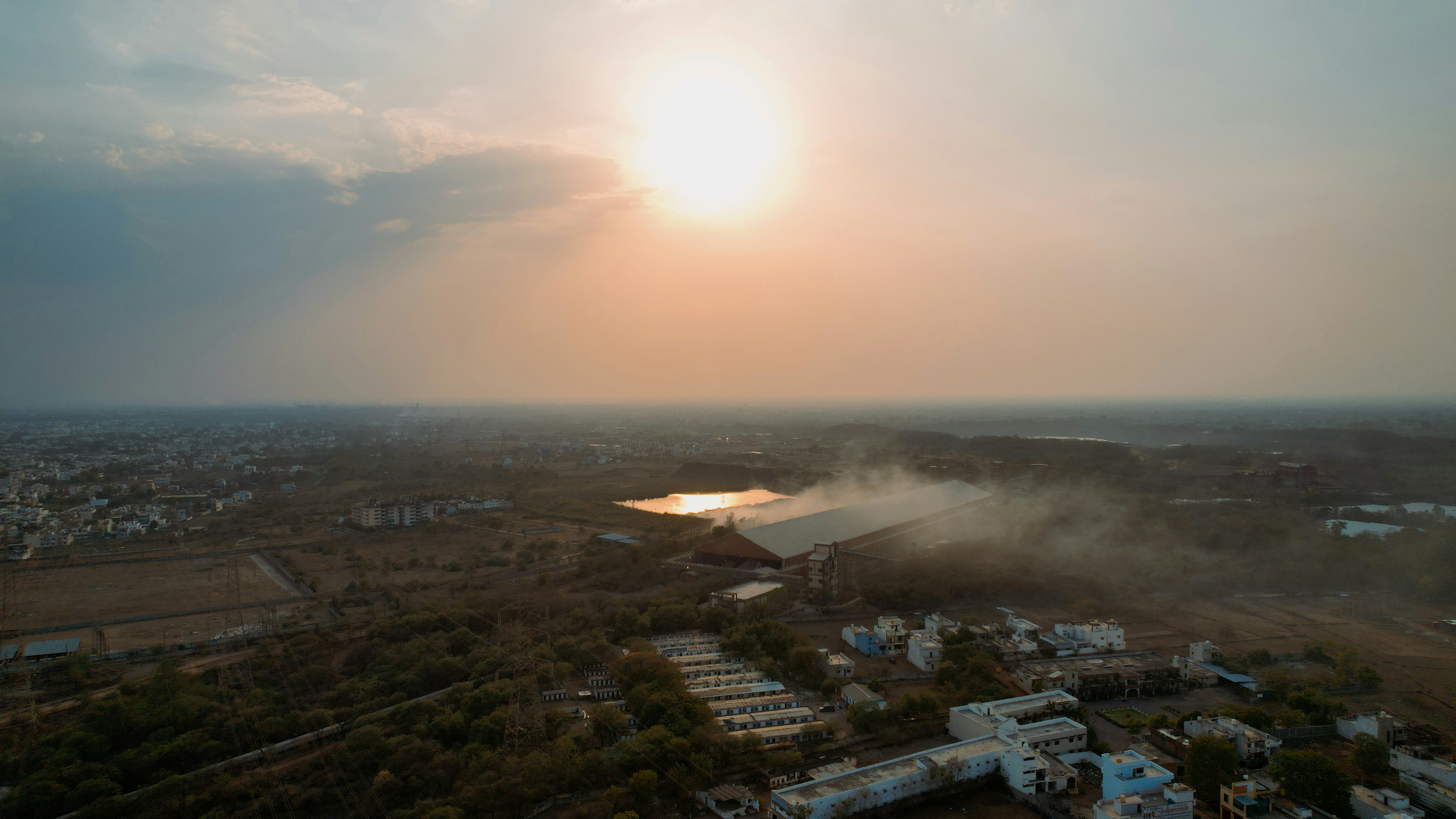 Low Sun, High Ground: A Glimpse Over Suburban Flatlands at Dusk