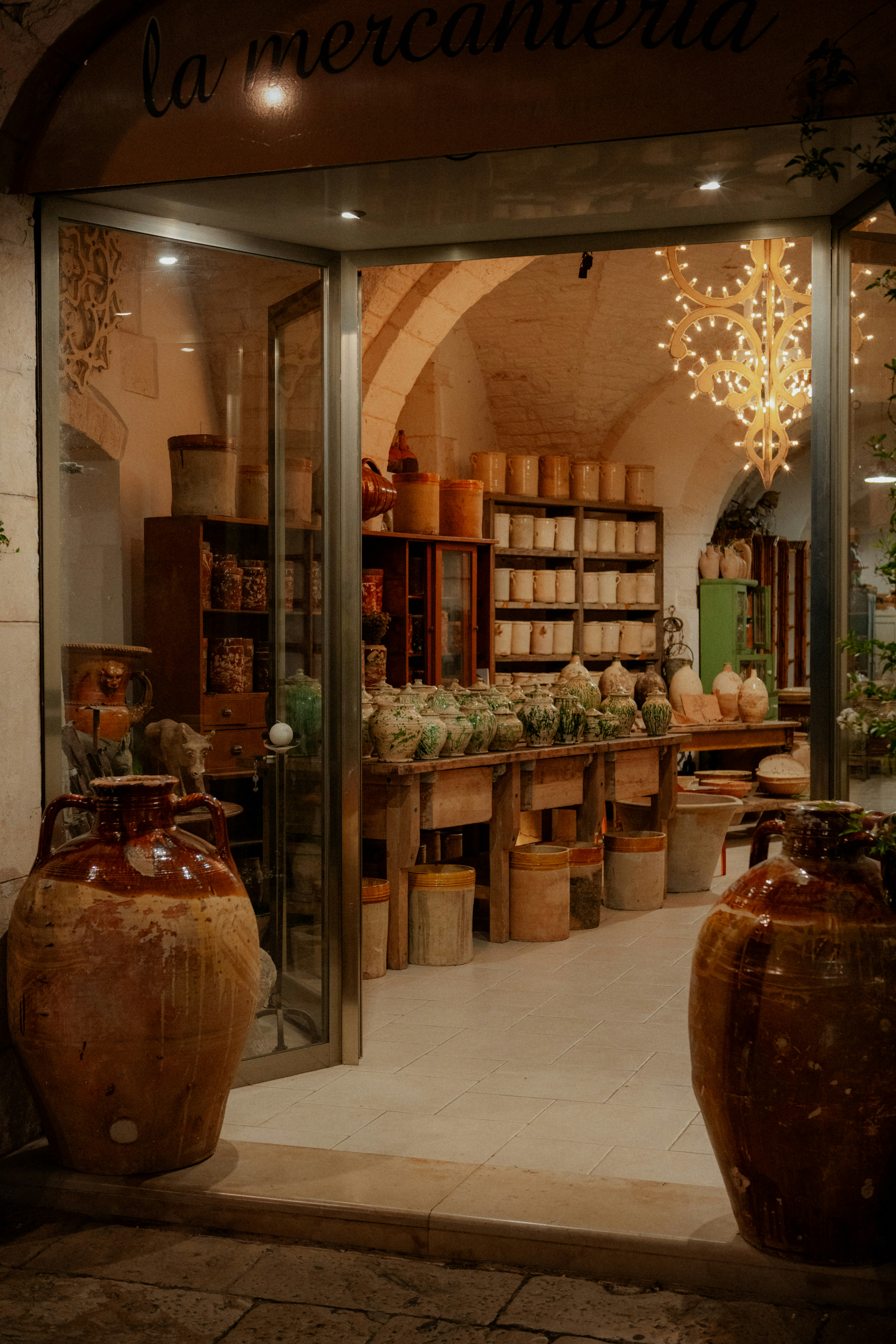 Terracotta Vessels and Warm Light Inside a Craft Shopfront