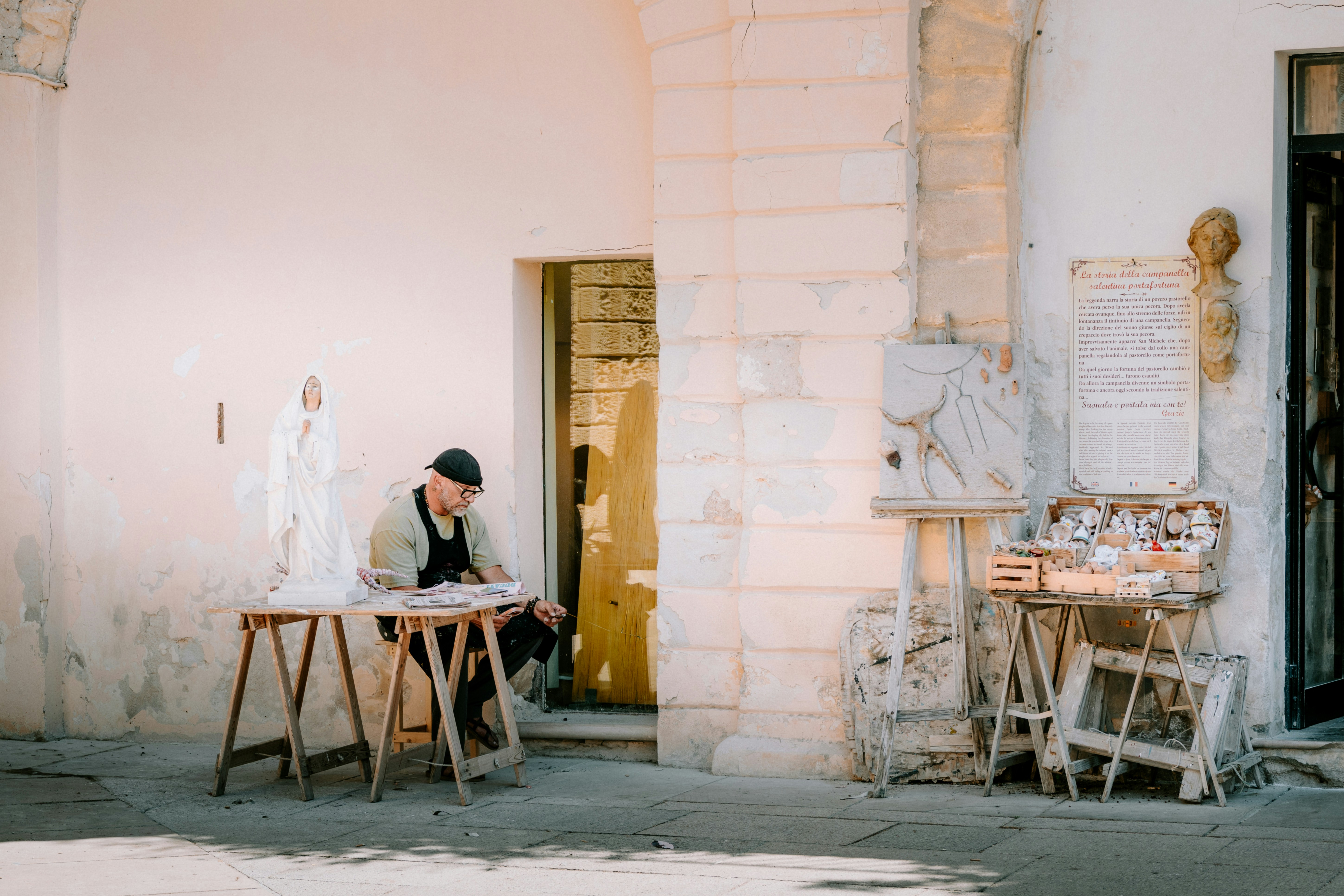 Stone Courtyard Sketch: A Luthier and a Sculpted Doorway