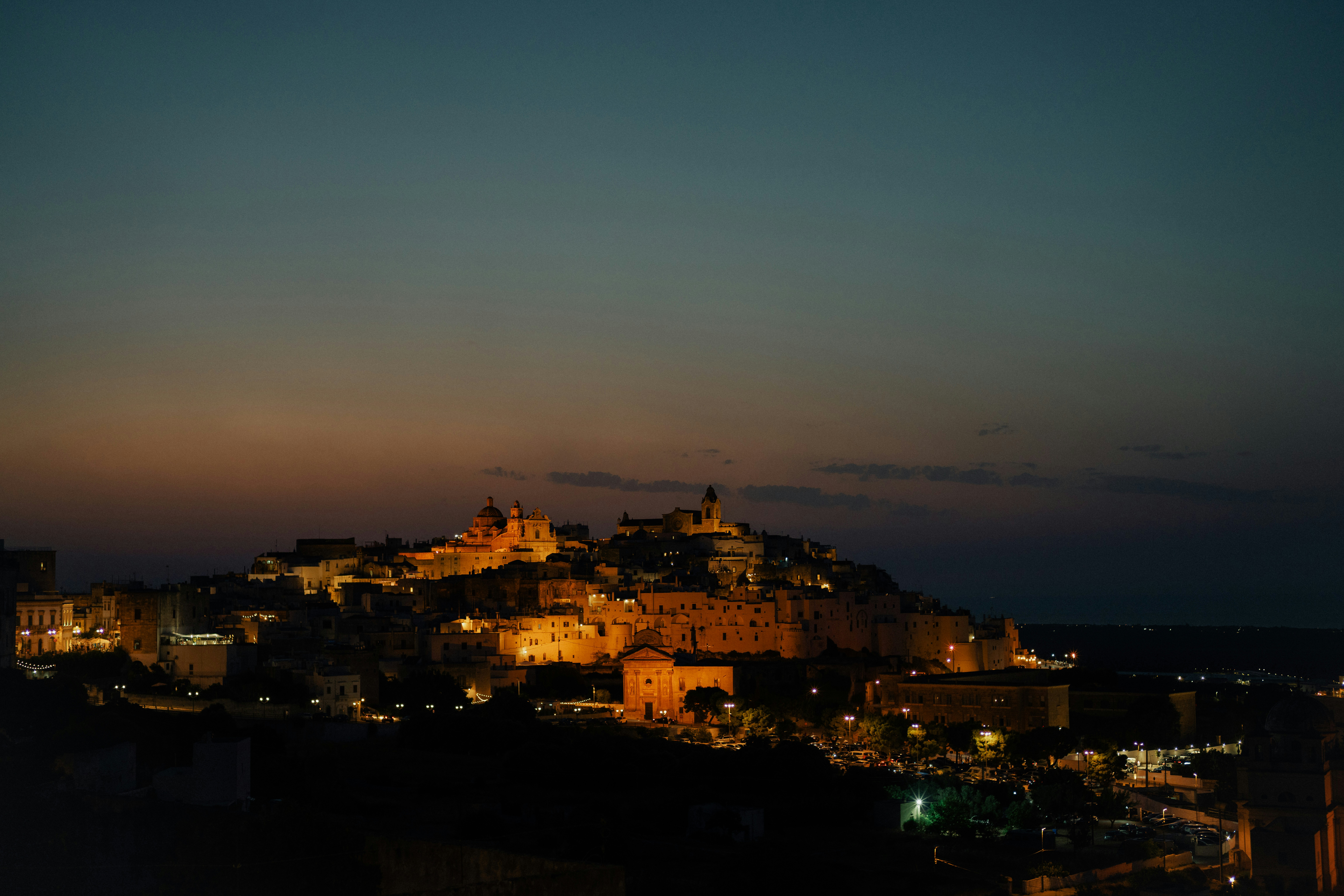 Evening Citadel: Warm Lights Outline a Hilltop Fortress