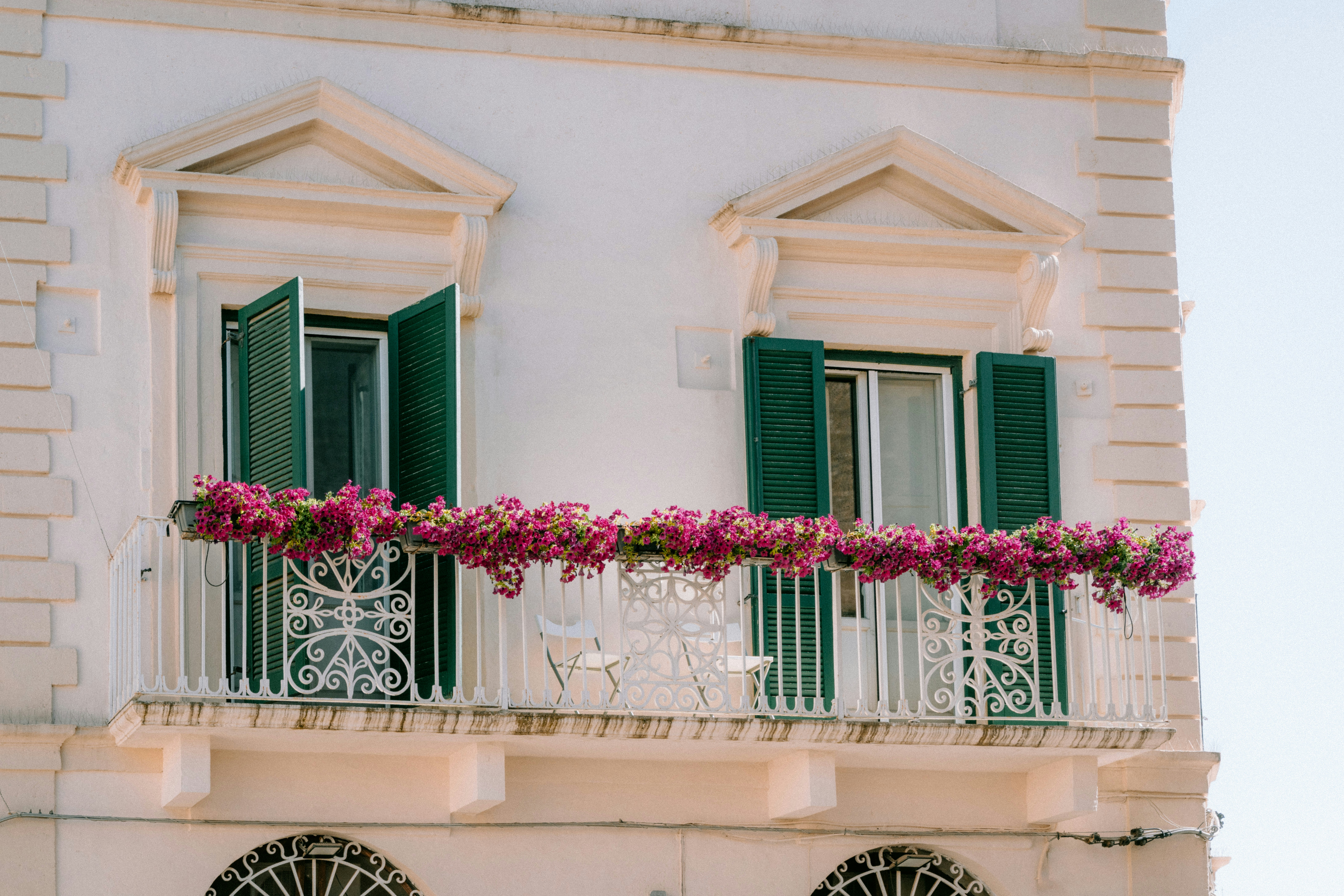 Balcony Blooms over a Mediterranean Facade
