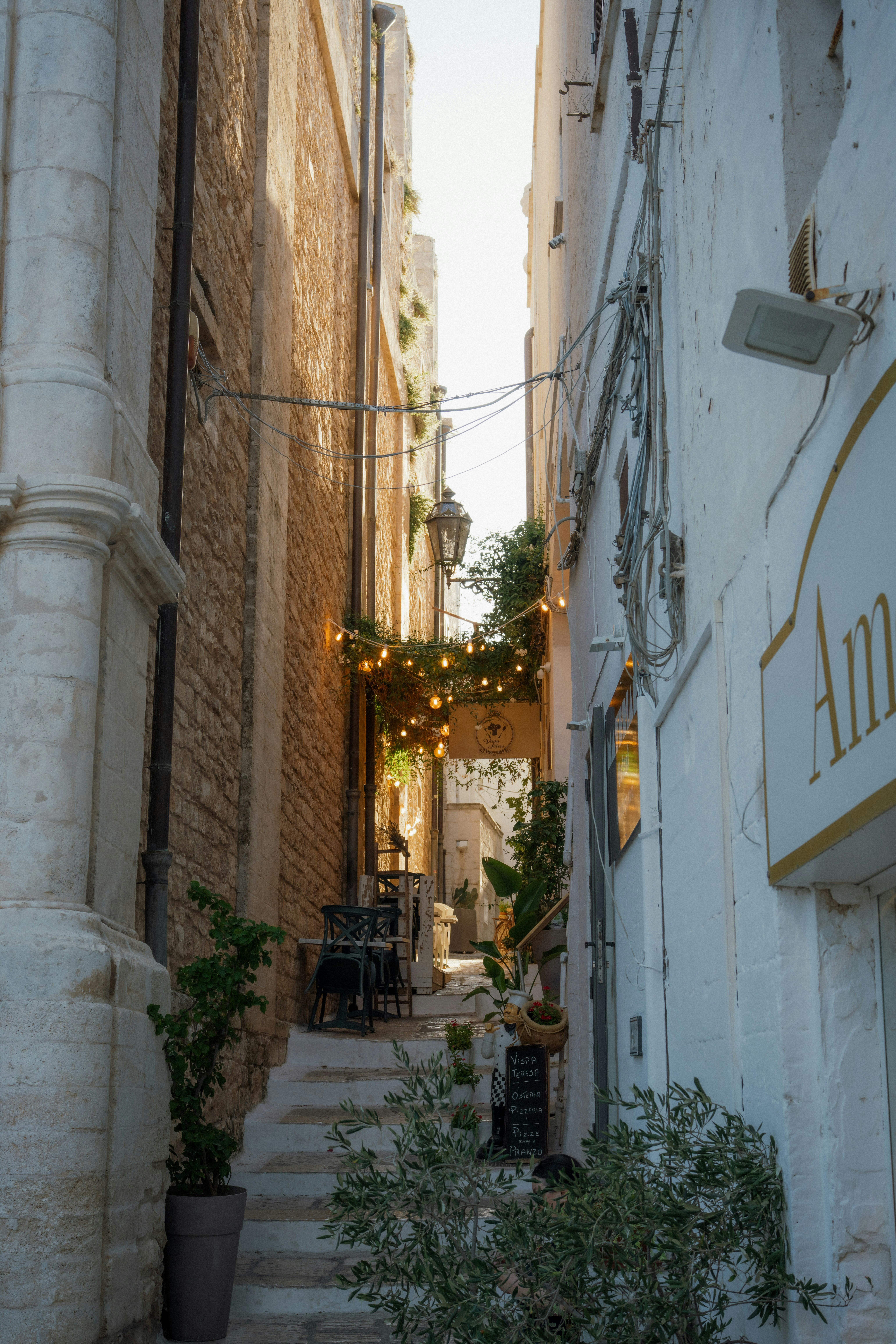 Lantern-lit Alleyway Bistro Between Stone Facades