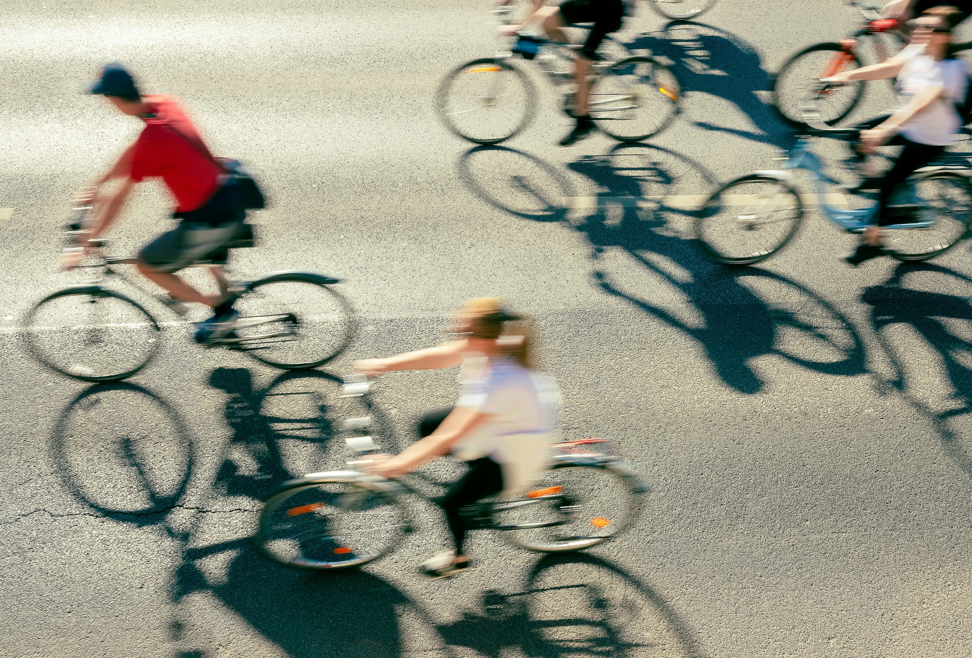 Blurred Pedal Power: A Street Cyclist Chorus in Motion