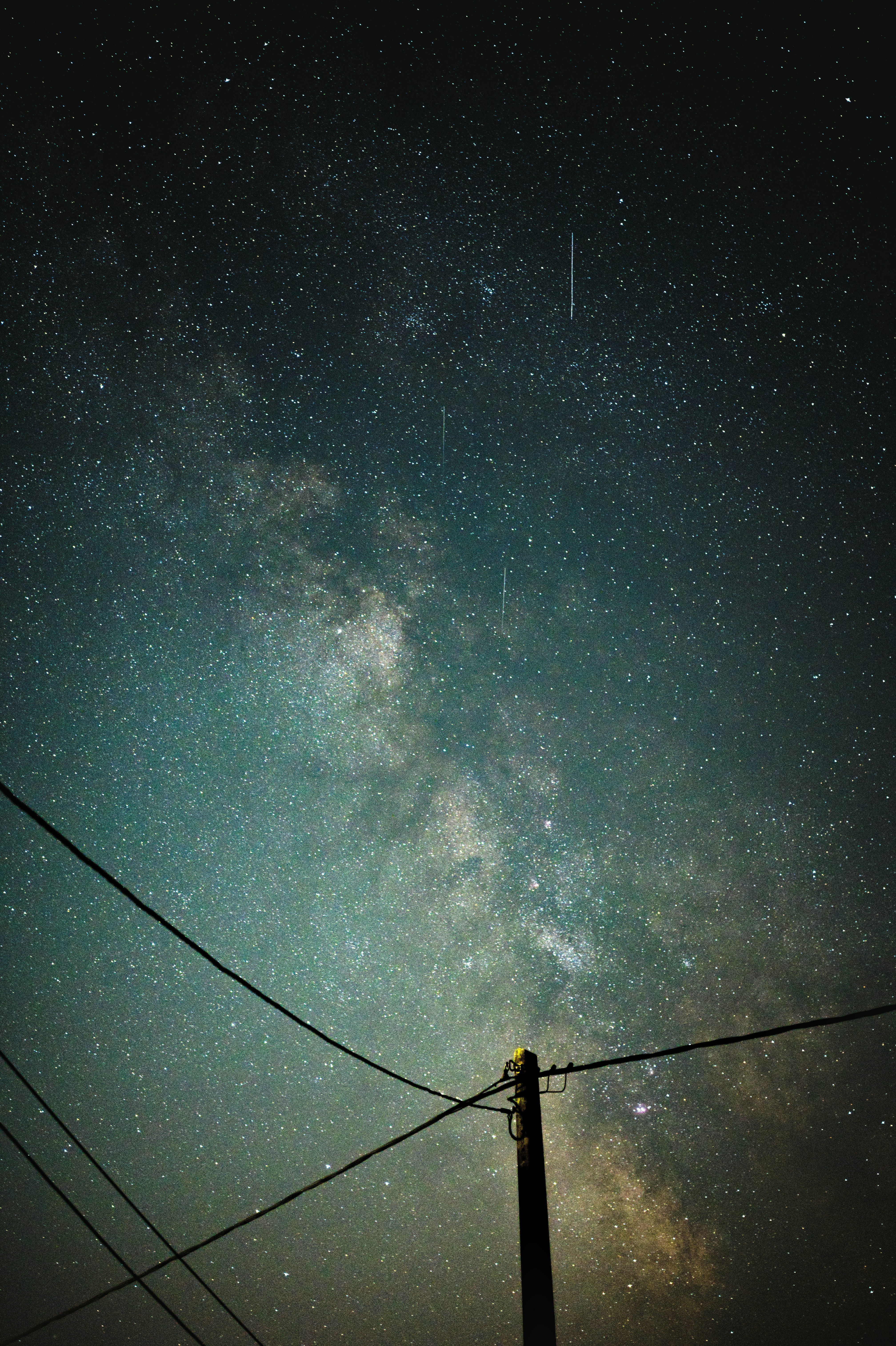 Milky Way over Wires: Night Sky Embraces a Quiet Horizon