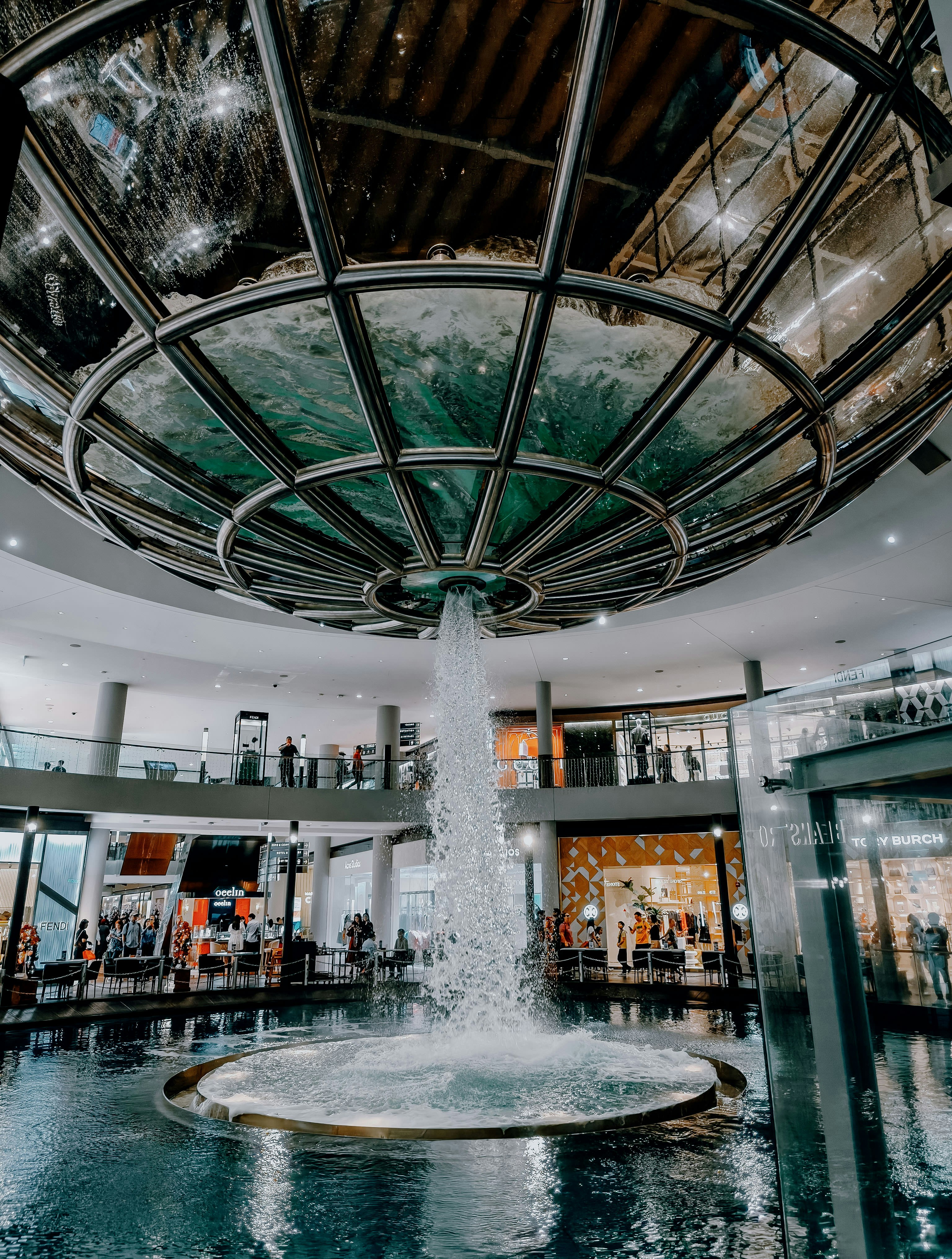 Gravity of Glass and Water: A Centered Atrium Reflection