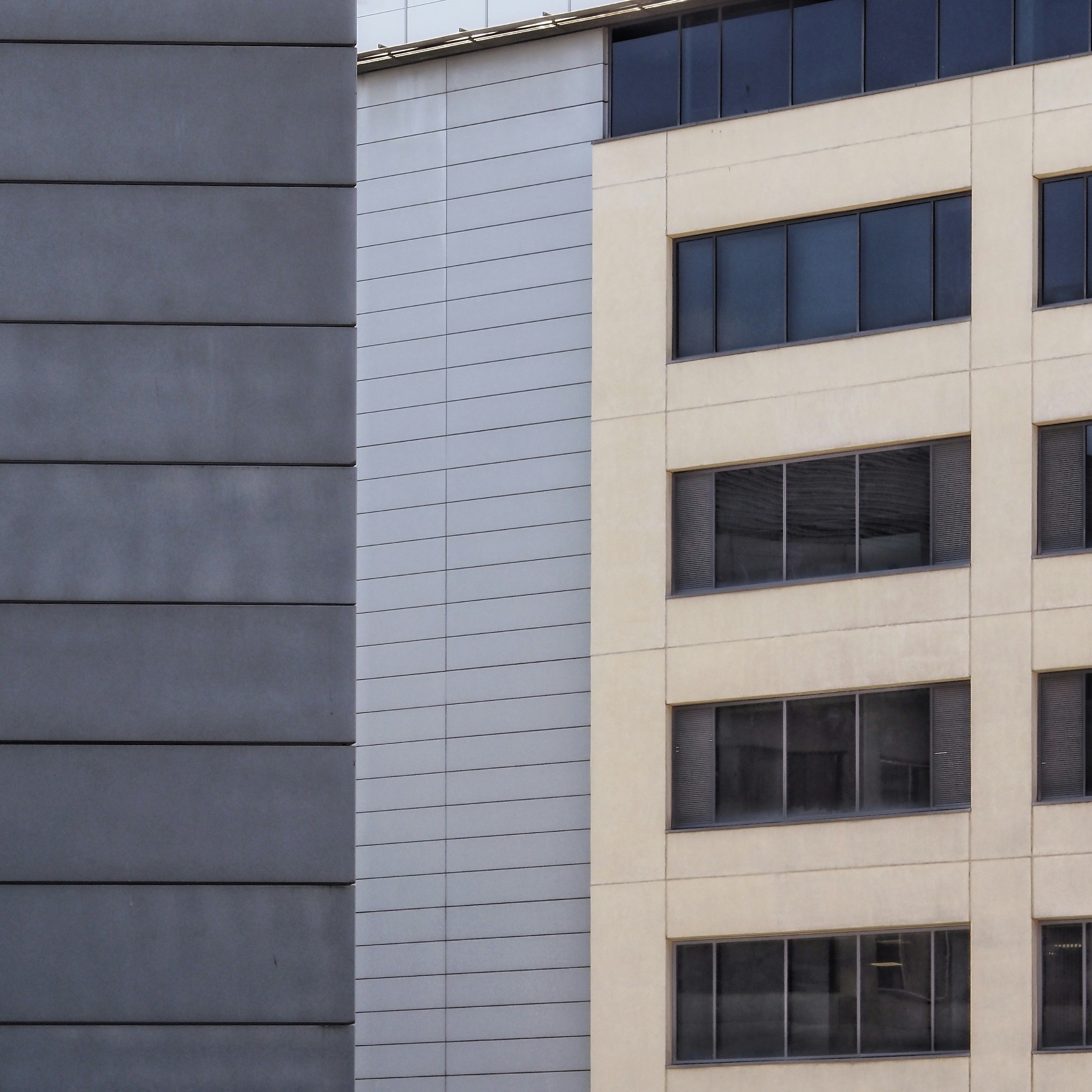 Concrete Facade Confluence: Vertical Strata of Modern Architecture