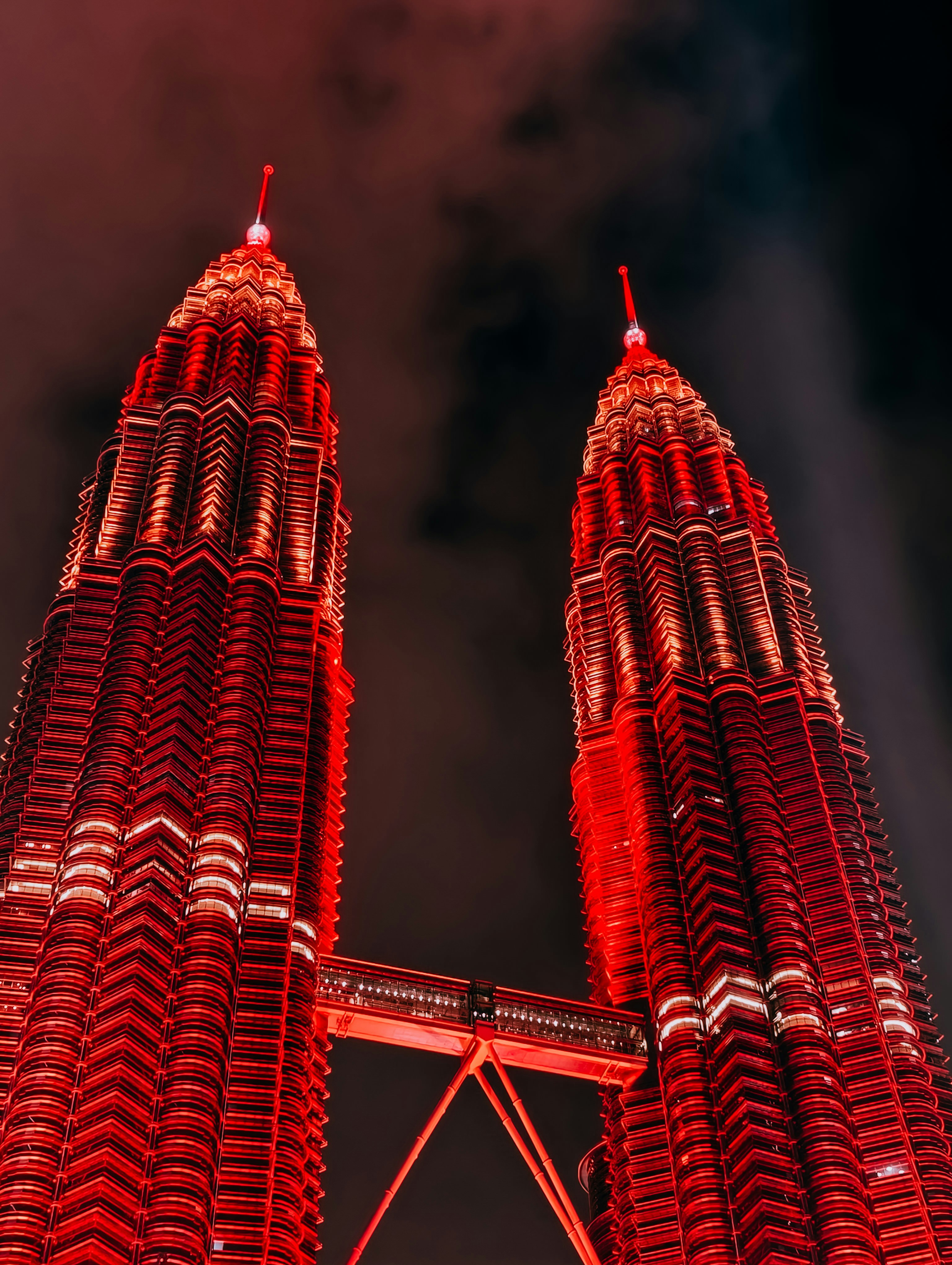 Twin Towers in crimson glow: Nighttime silhouette of Kuala Lumpur's iconic skyline