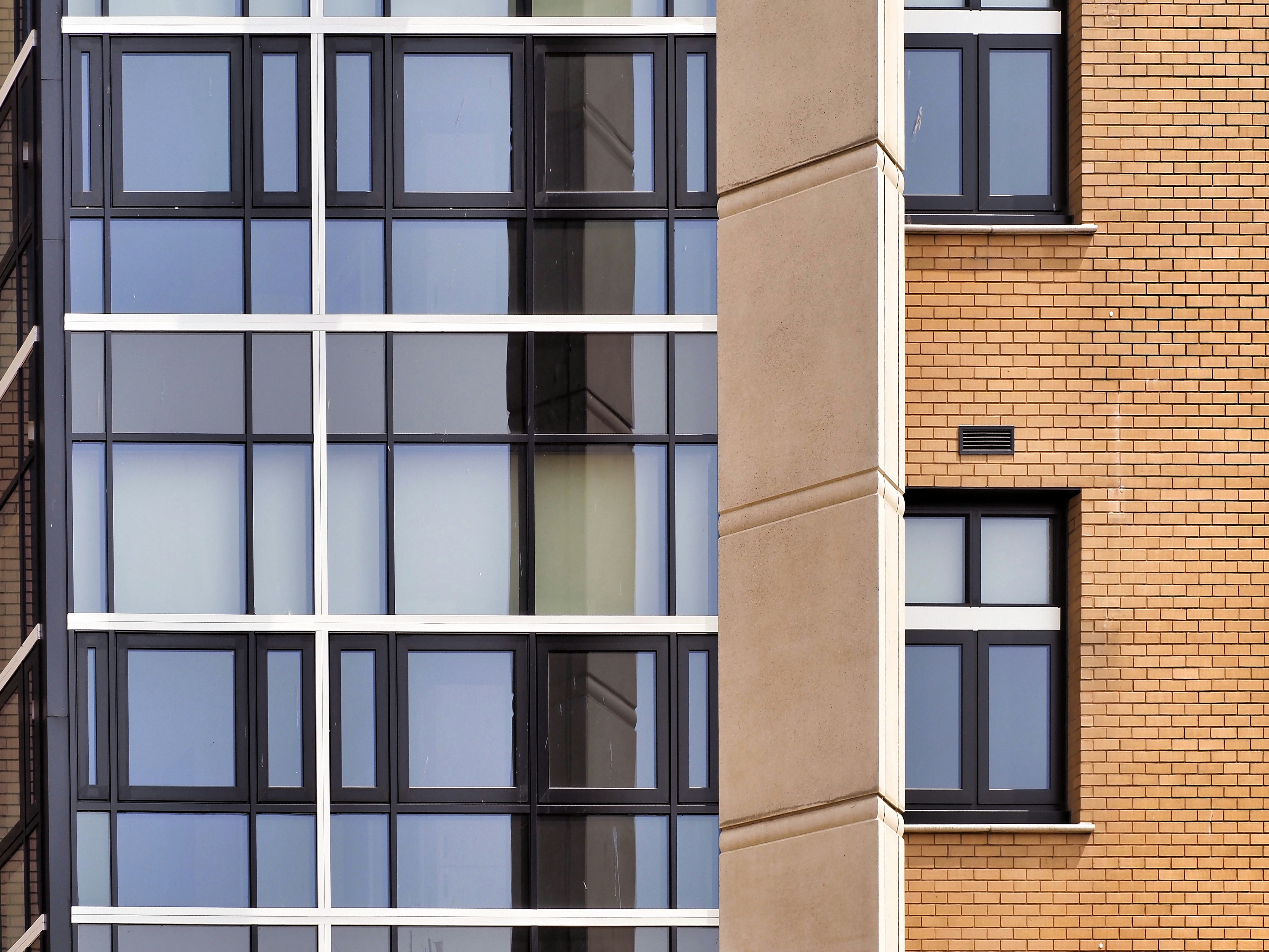 Intersecting Facades: Grid and Brick in Quiet Light