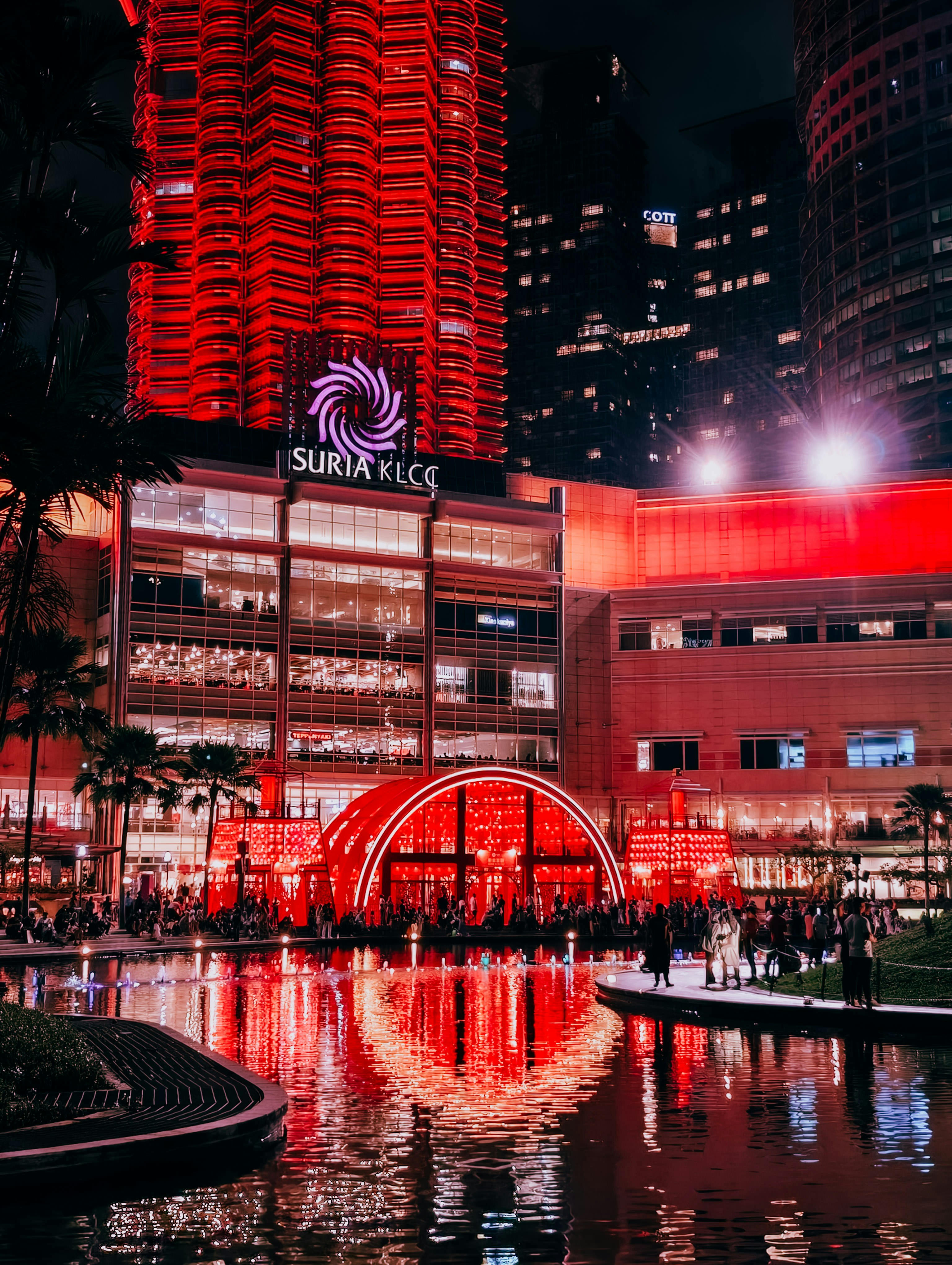 The Petronas Twin Towers illuminated in red for Chinese New Year in Kuala Lumpur, Malaysia, creating a dramatic night-time view of one of the city’s most iconic architectural landmarks.