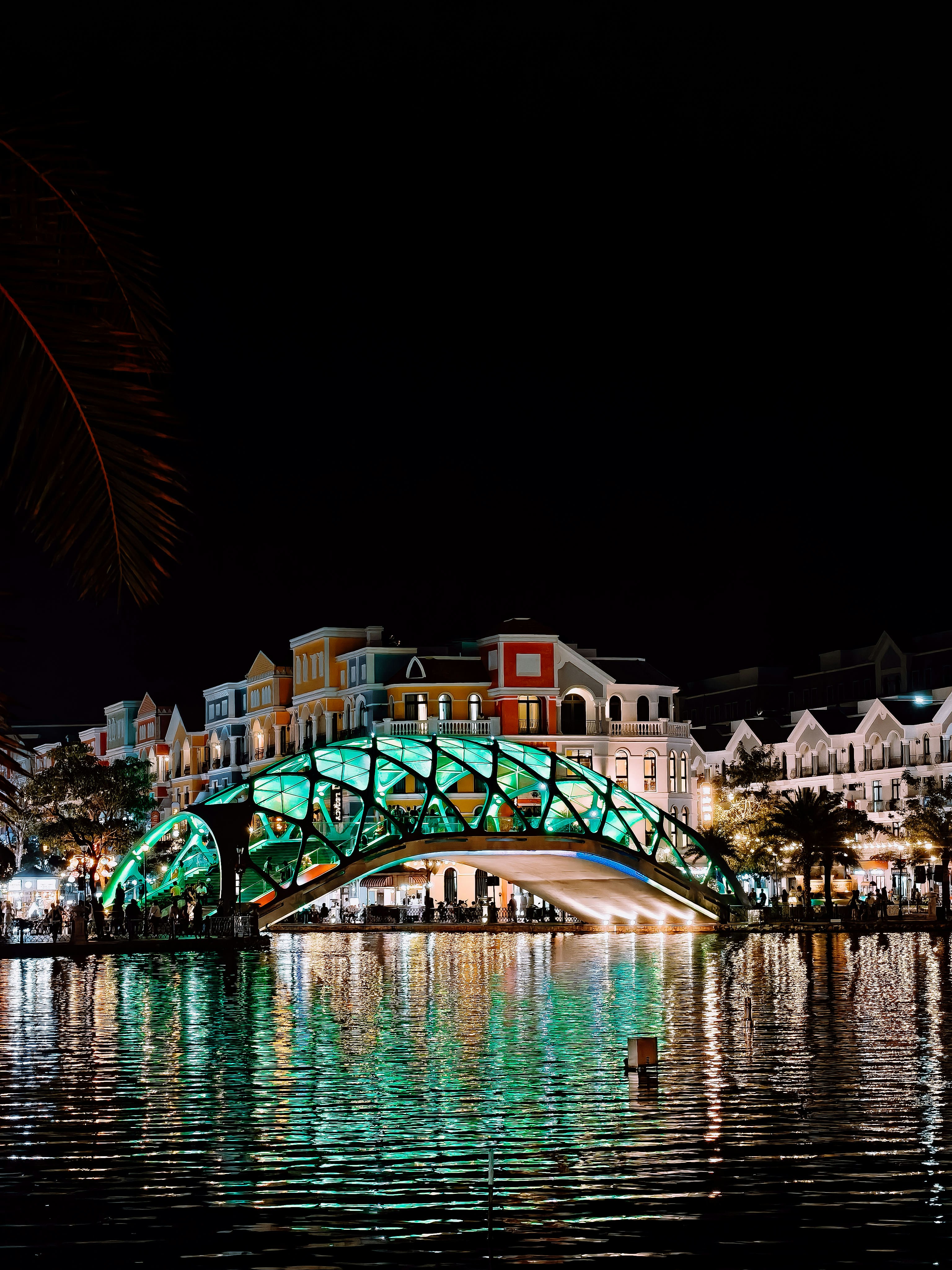 Neon-Arch Over Pond: Nighttime Harbor of Colors