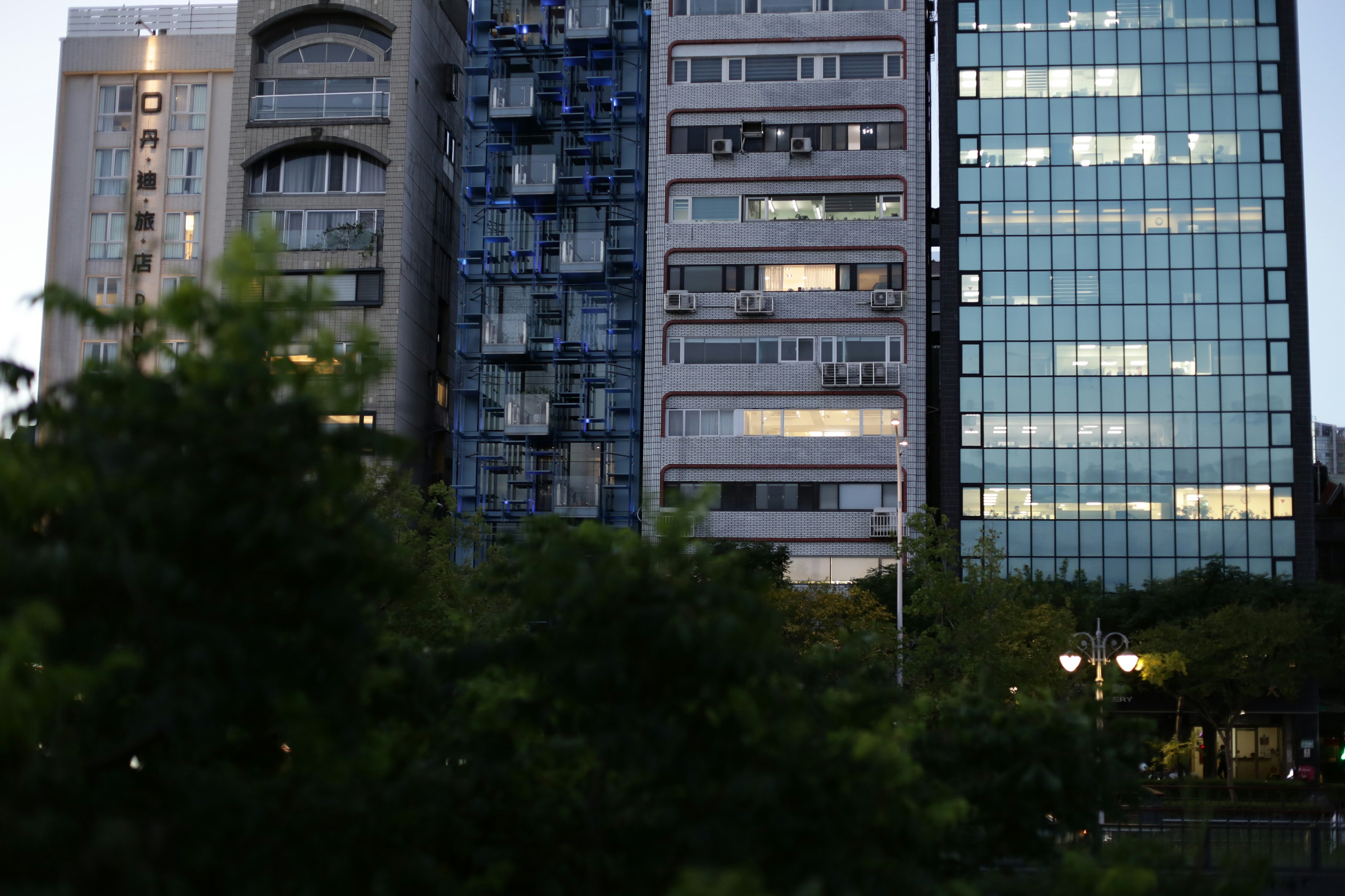 Glass and Concrete Reflections: Urban Facade at Dusk