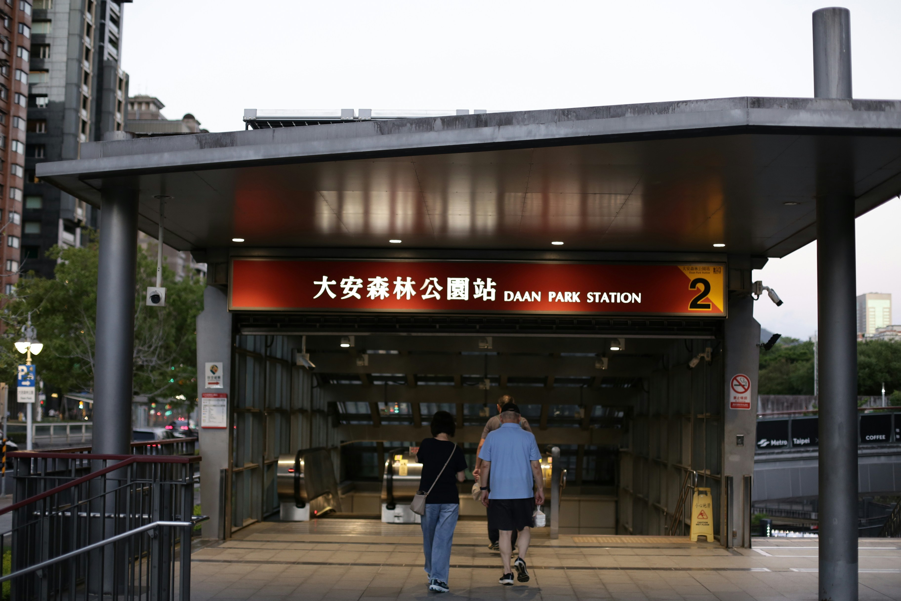 Underground Rise: Two commuters enter the city’s red-lit station