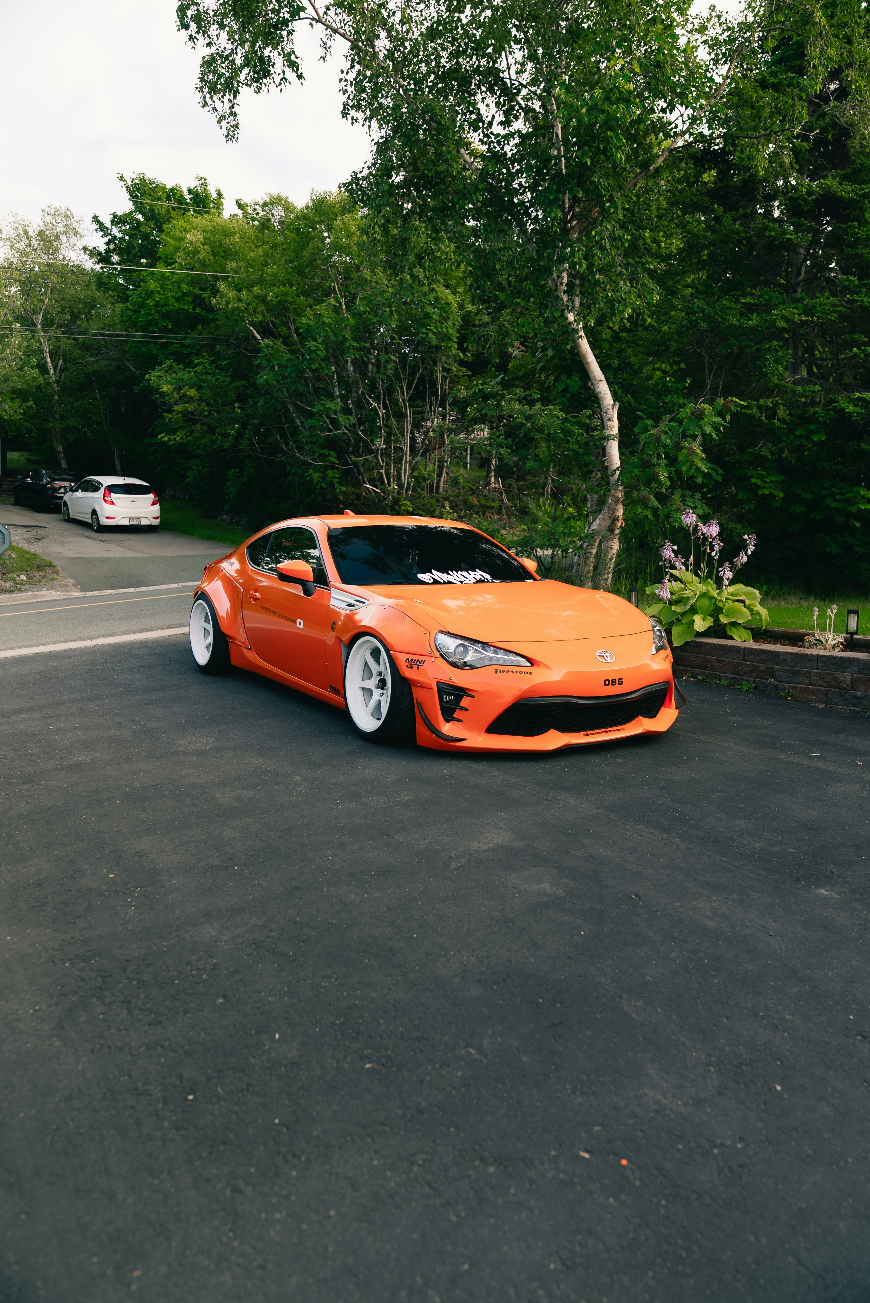Orange Drifter: A Low-Slung Powerhouse in a Quiet Driveway