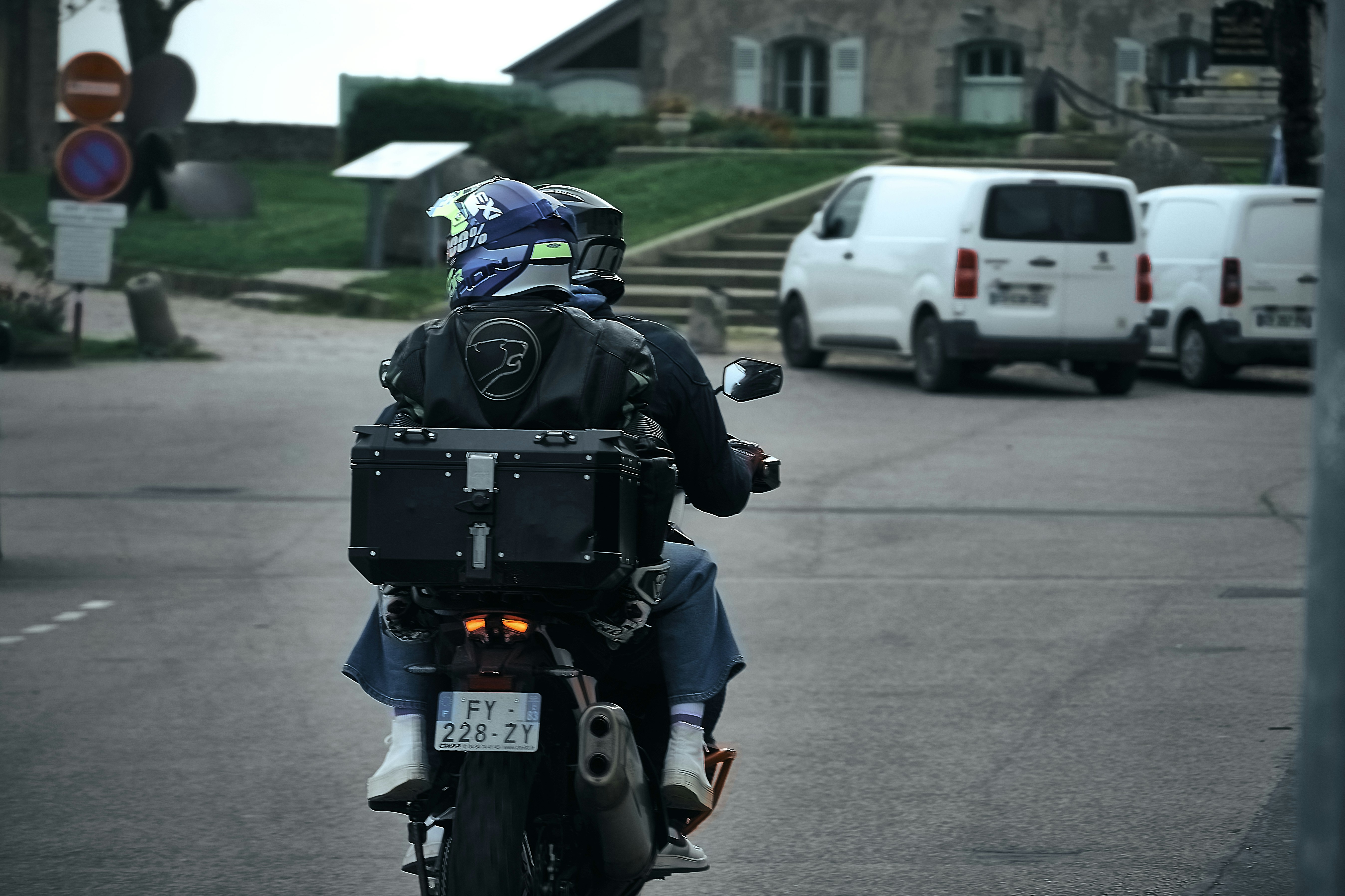 Rear-View Rider in Transit—Attached Toolbox and Helmet Detail