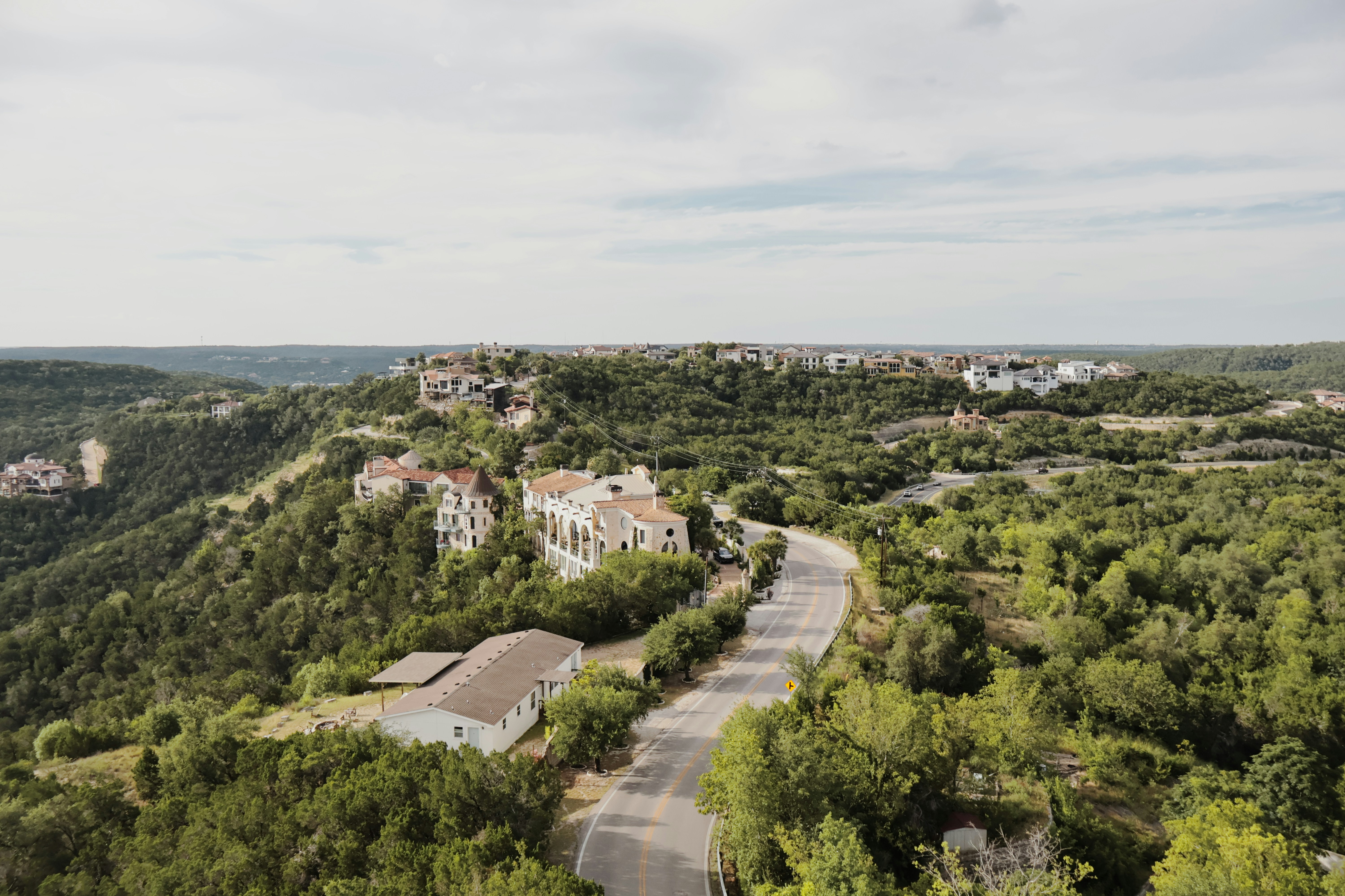 Serpentine hillside village tucked along a winding road