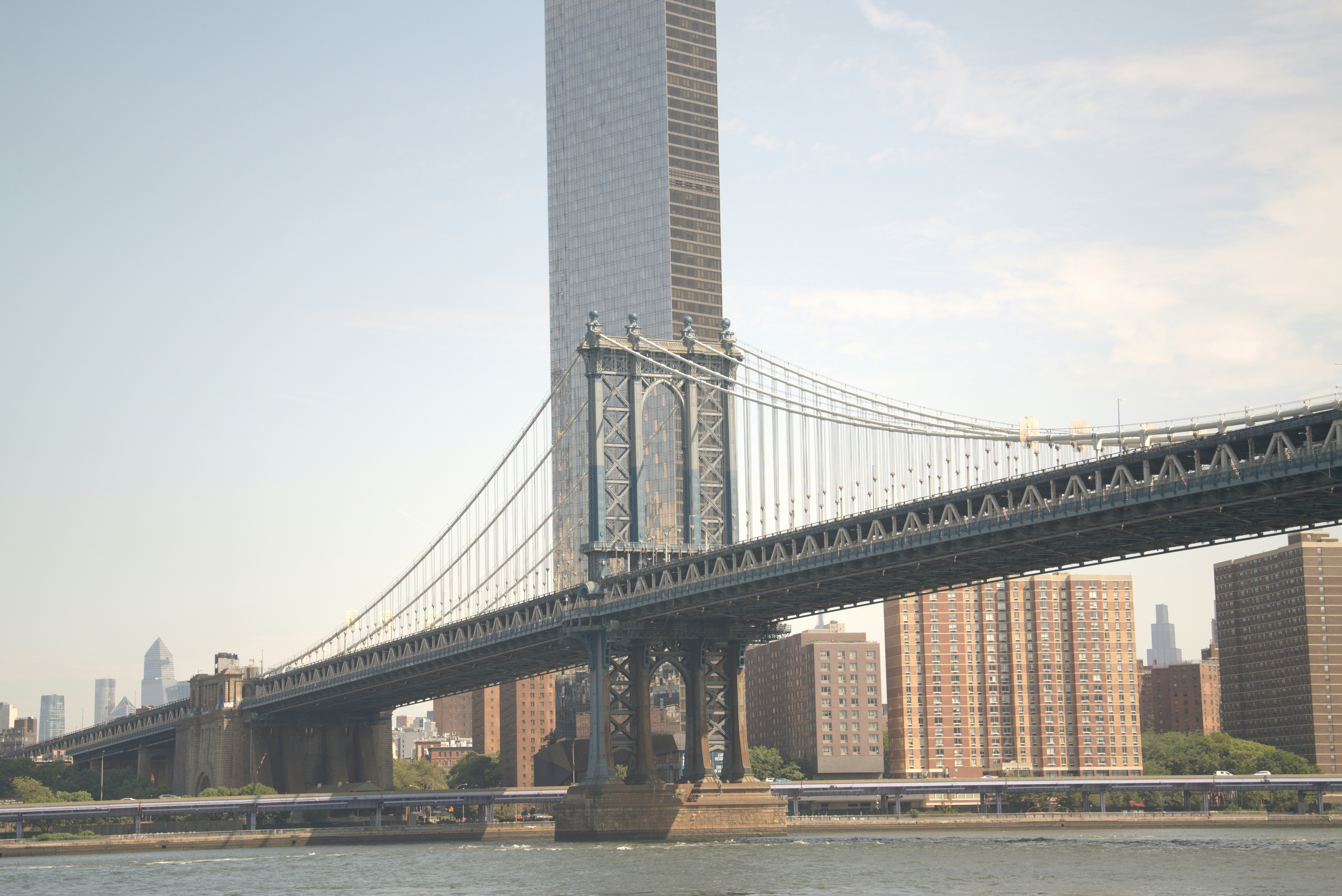 Urban Span: A Cityscape Bridge Framed by Steel and Skyline
