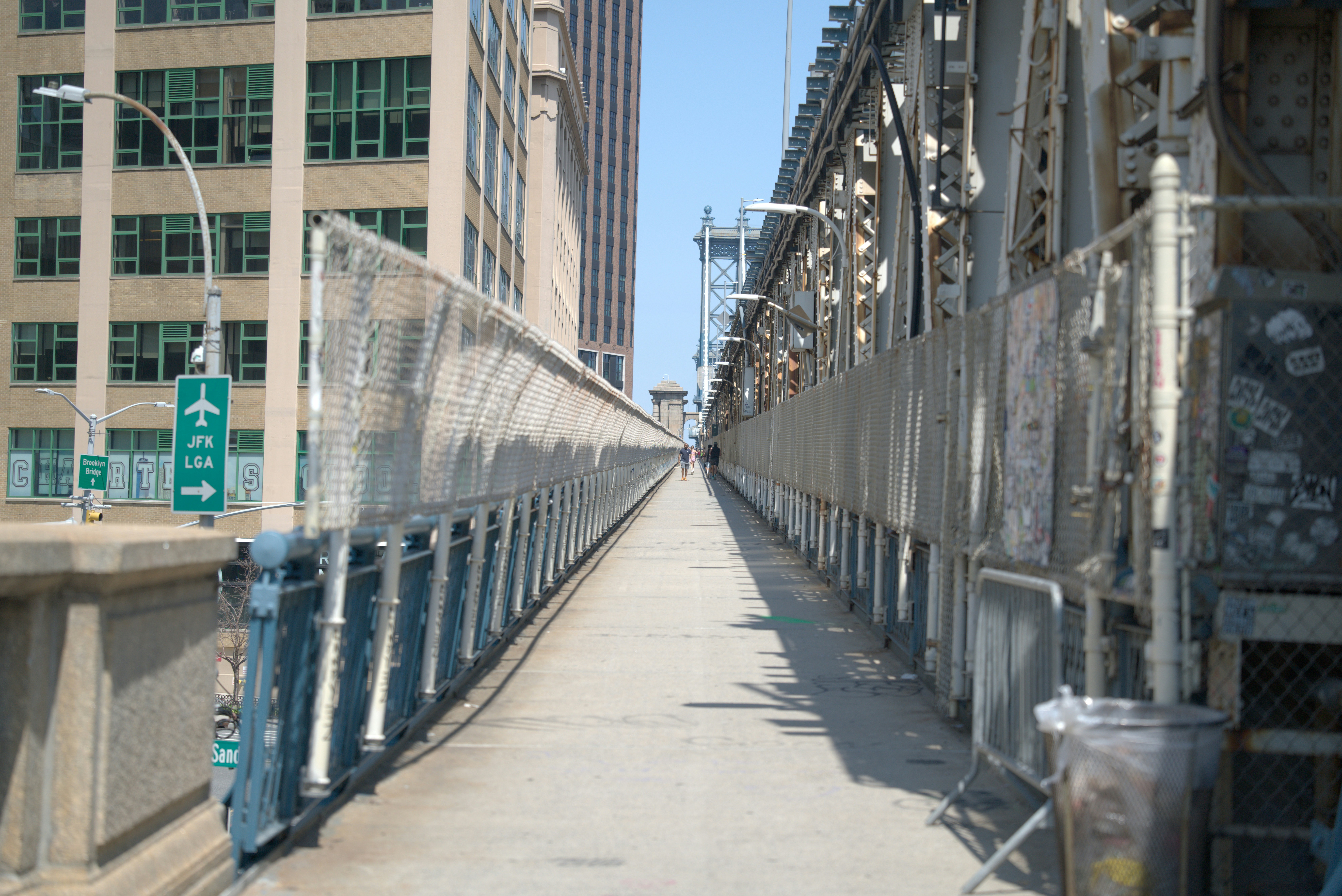 A Lone Figure Traverses the Elevated Urban Spine