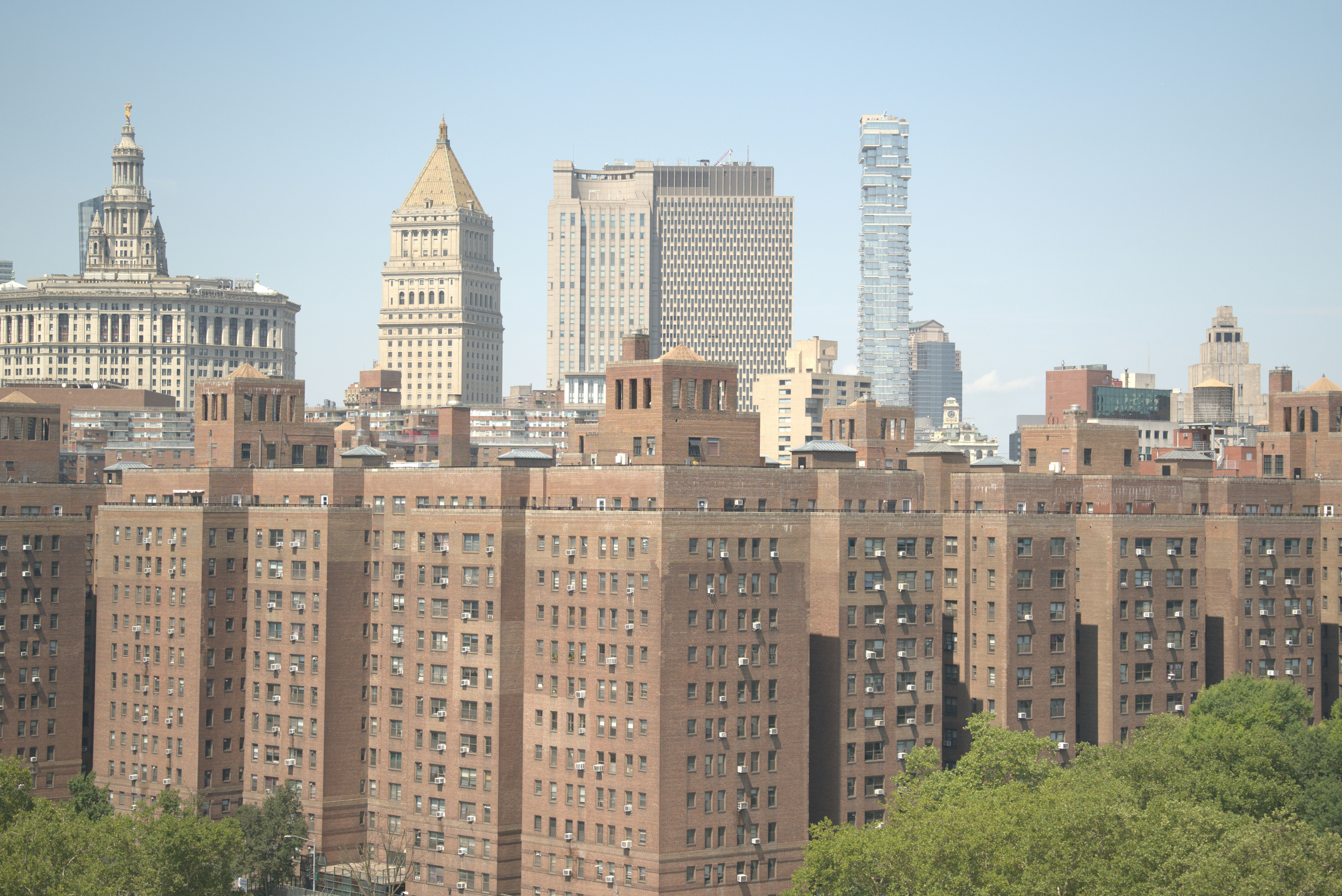 Urban Ridge: Rooftop Cityscape Over a Sea of Brick