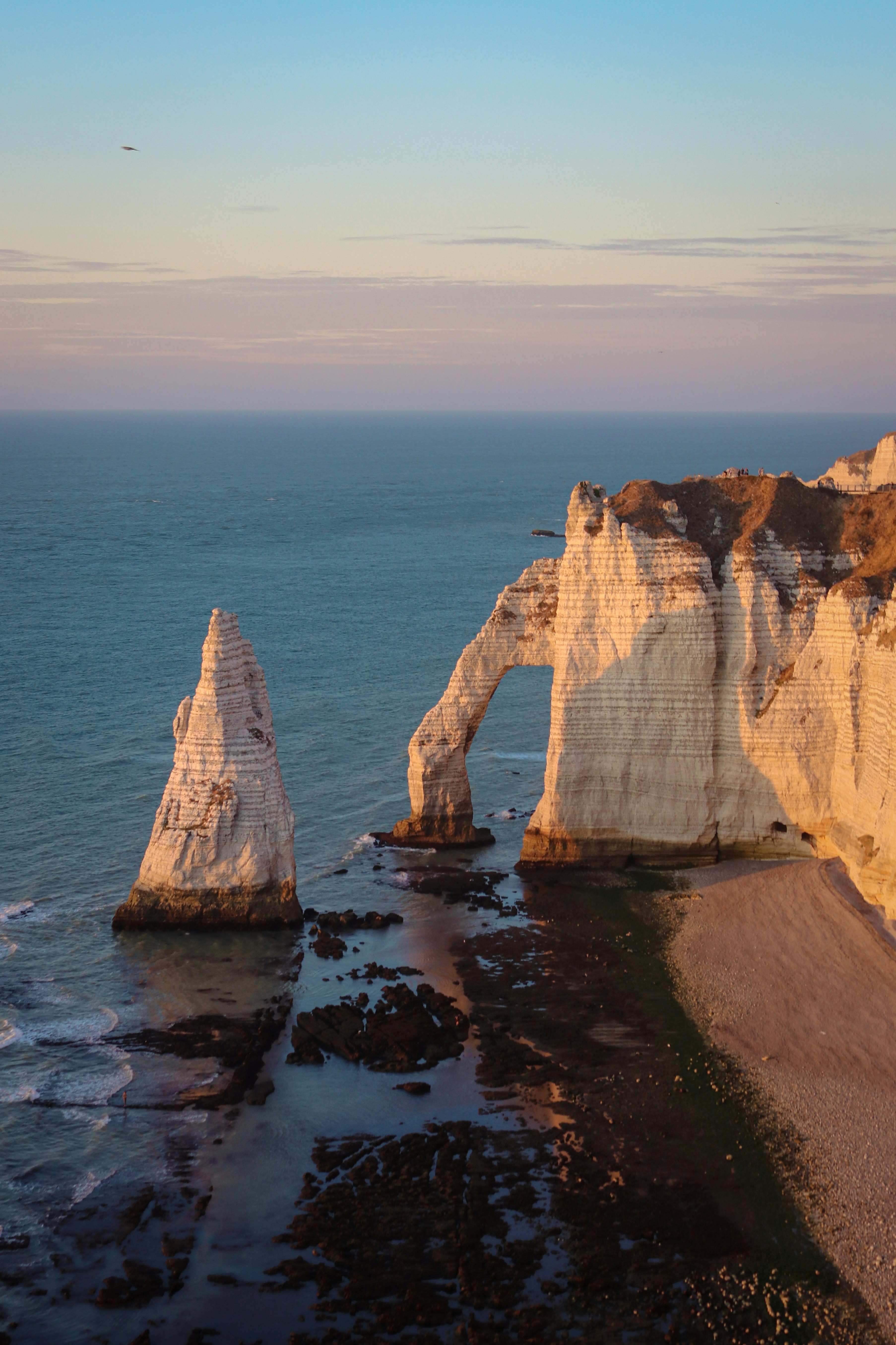 Sea Arches at Dusk: White Cliffs Embracing the Atlantic