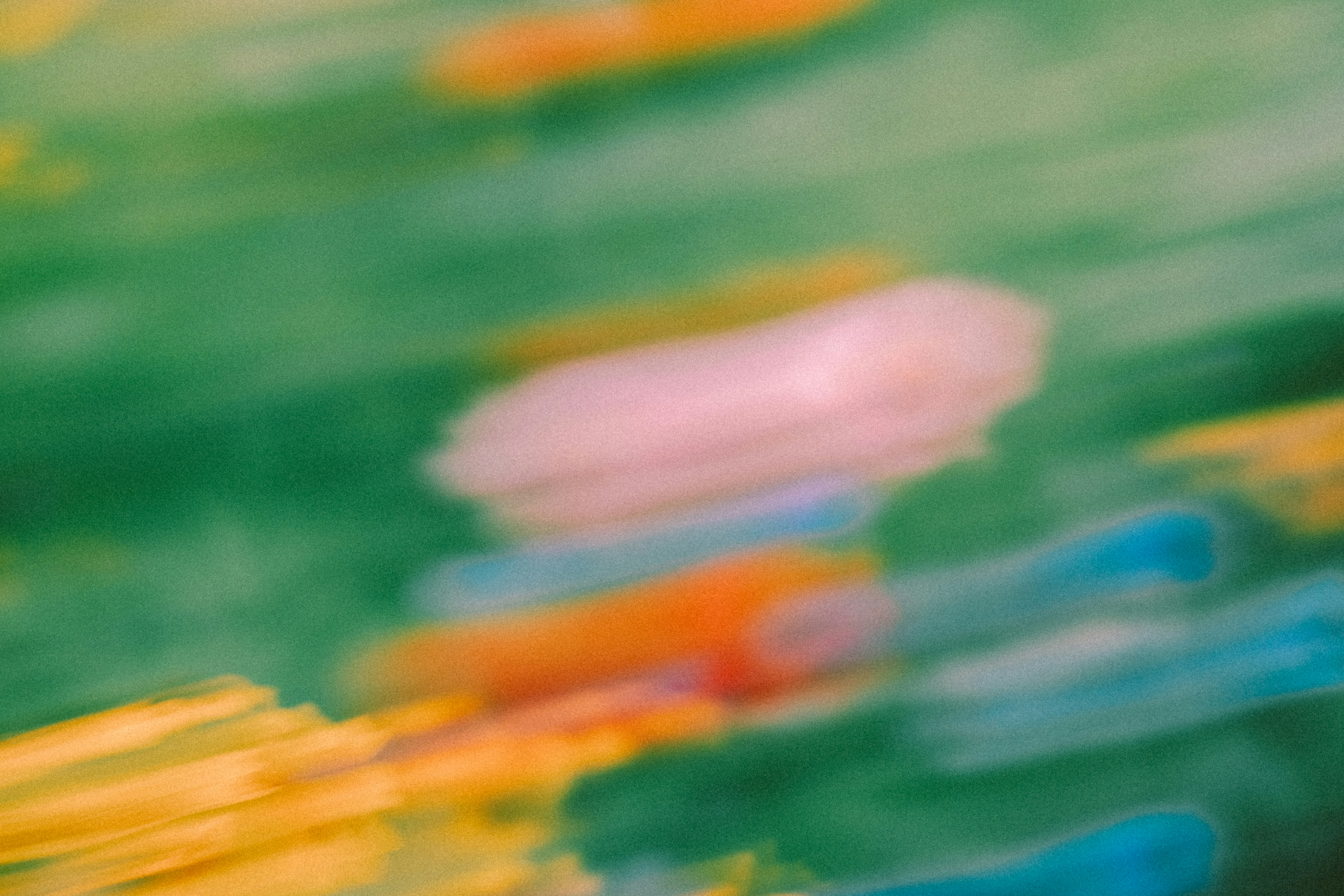 Motion Blur as Color: Abstract Waves of Green, Orange, and Pink