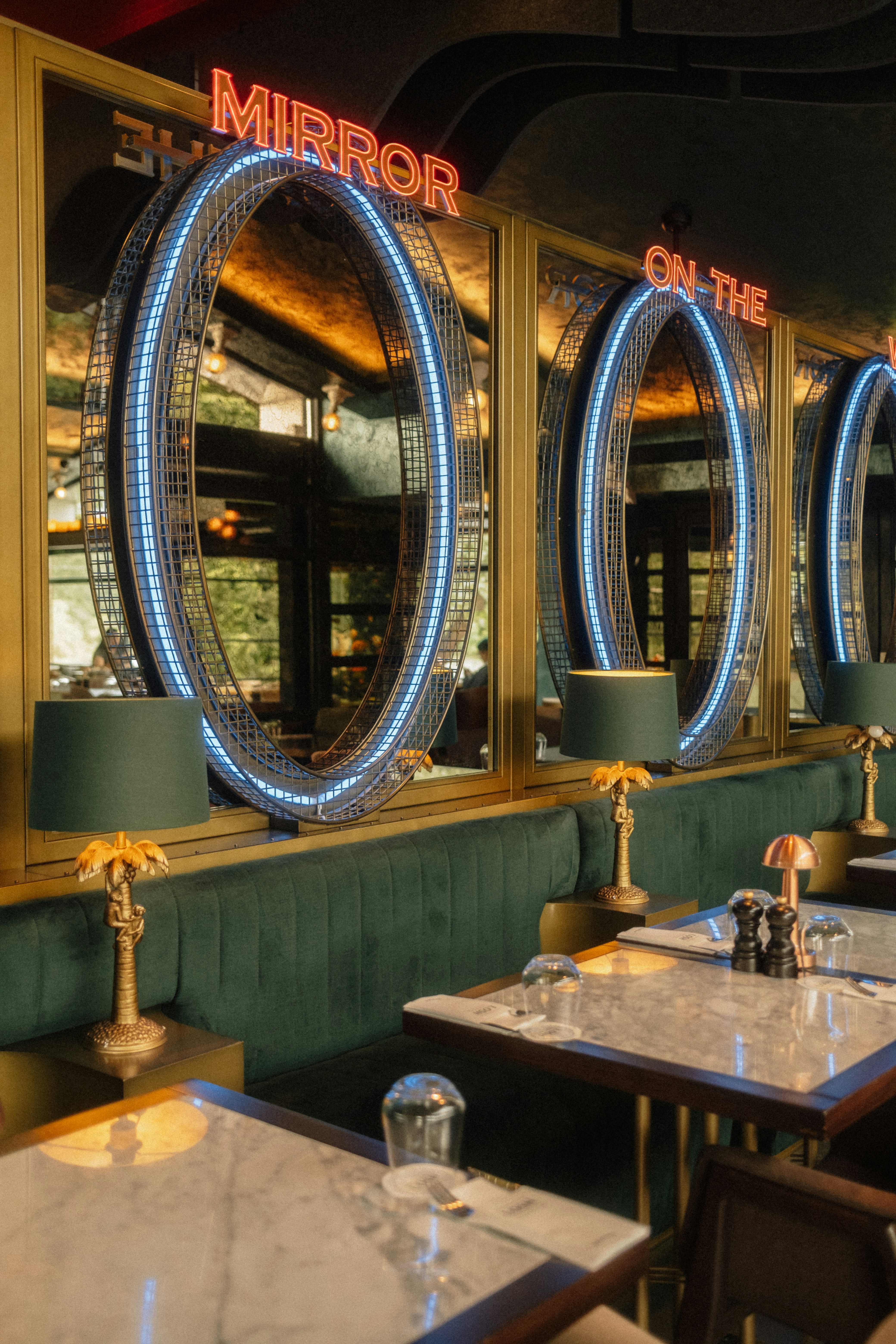 Neon Sign Reflections Above a Verdant Diner