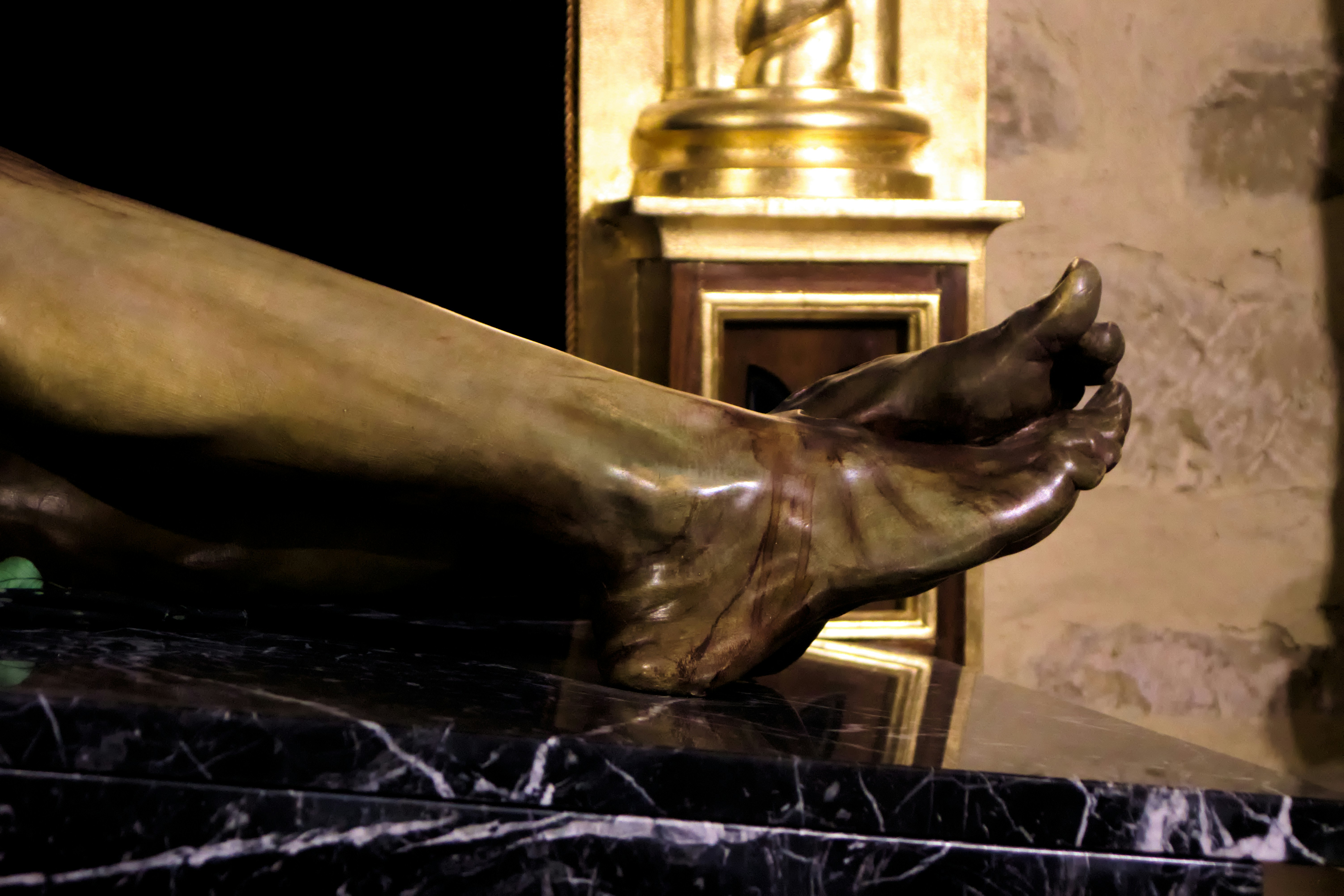 Resting Feet Beneath a Marble Ledge