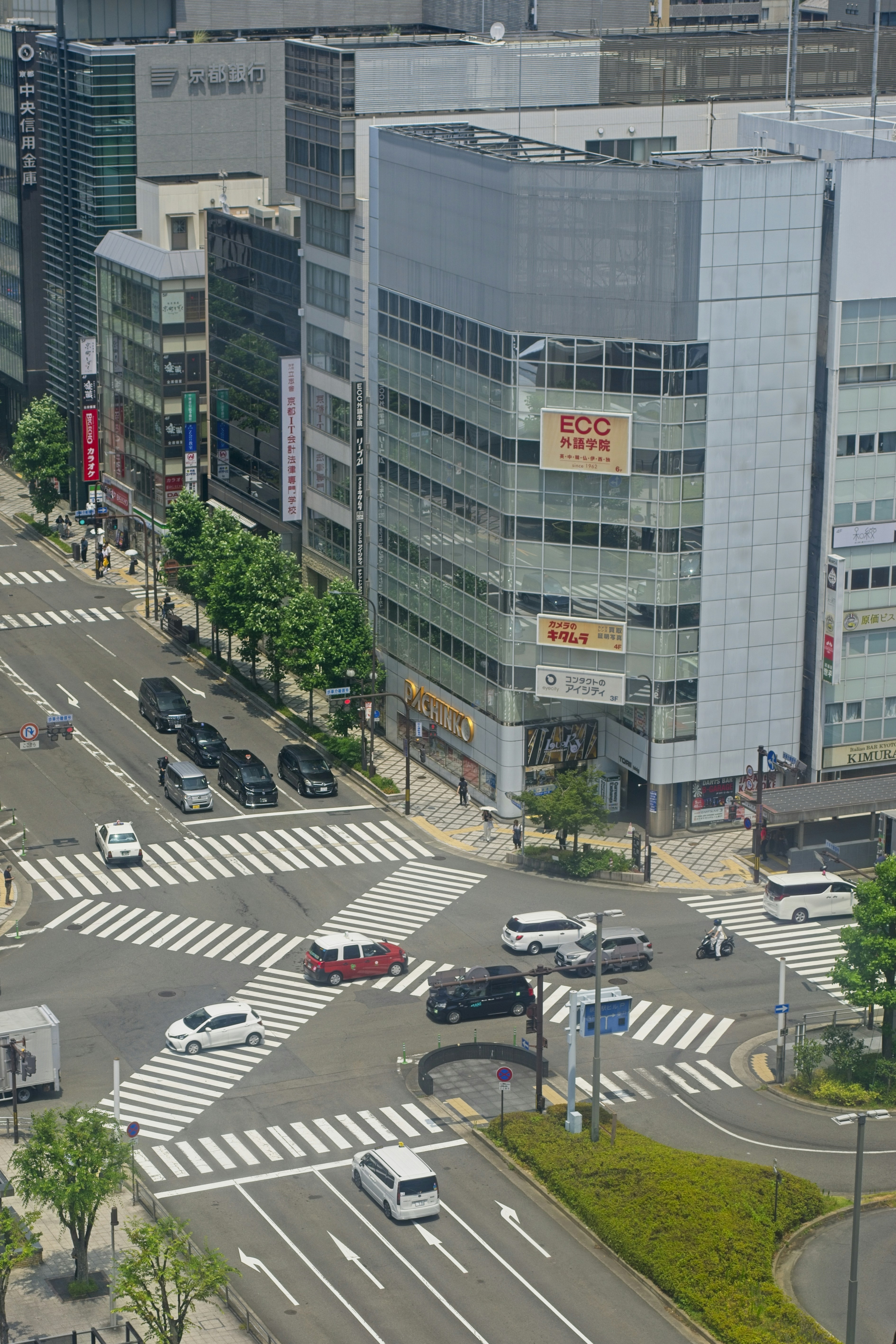 Urban Intersection: Aerial Rhythm Through Glass and Crosswalks