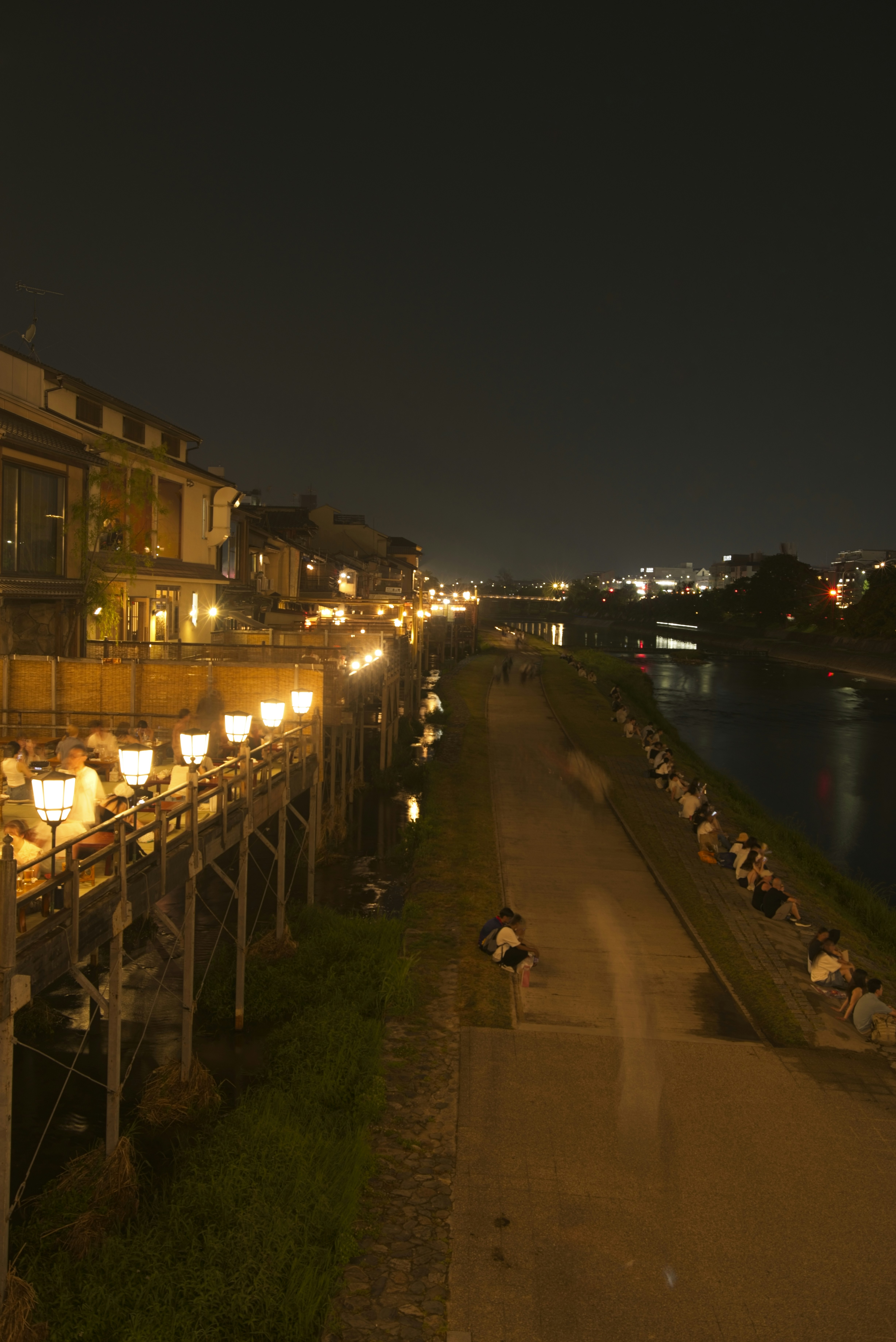 Luminous Riverside Promenade Under Evening Skies