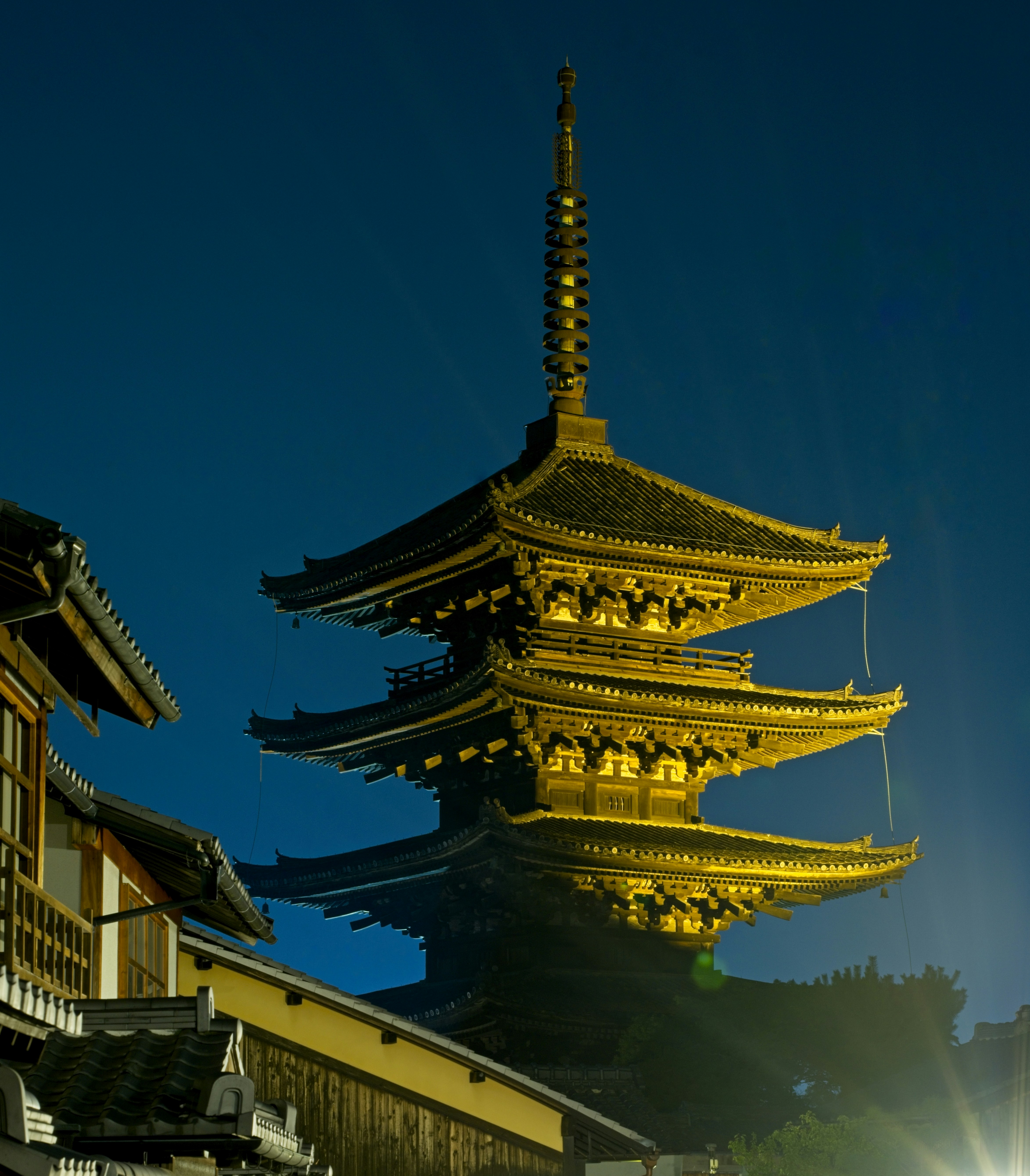 Rising in the Golden Hour: A Timeless Pagoda Over the Rooftops