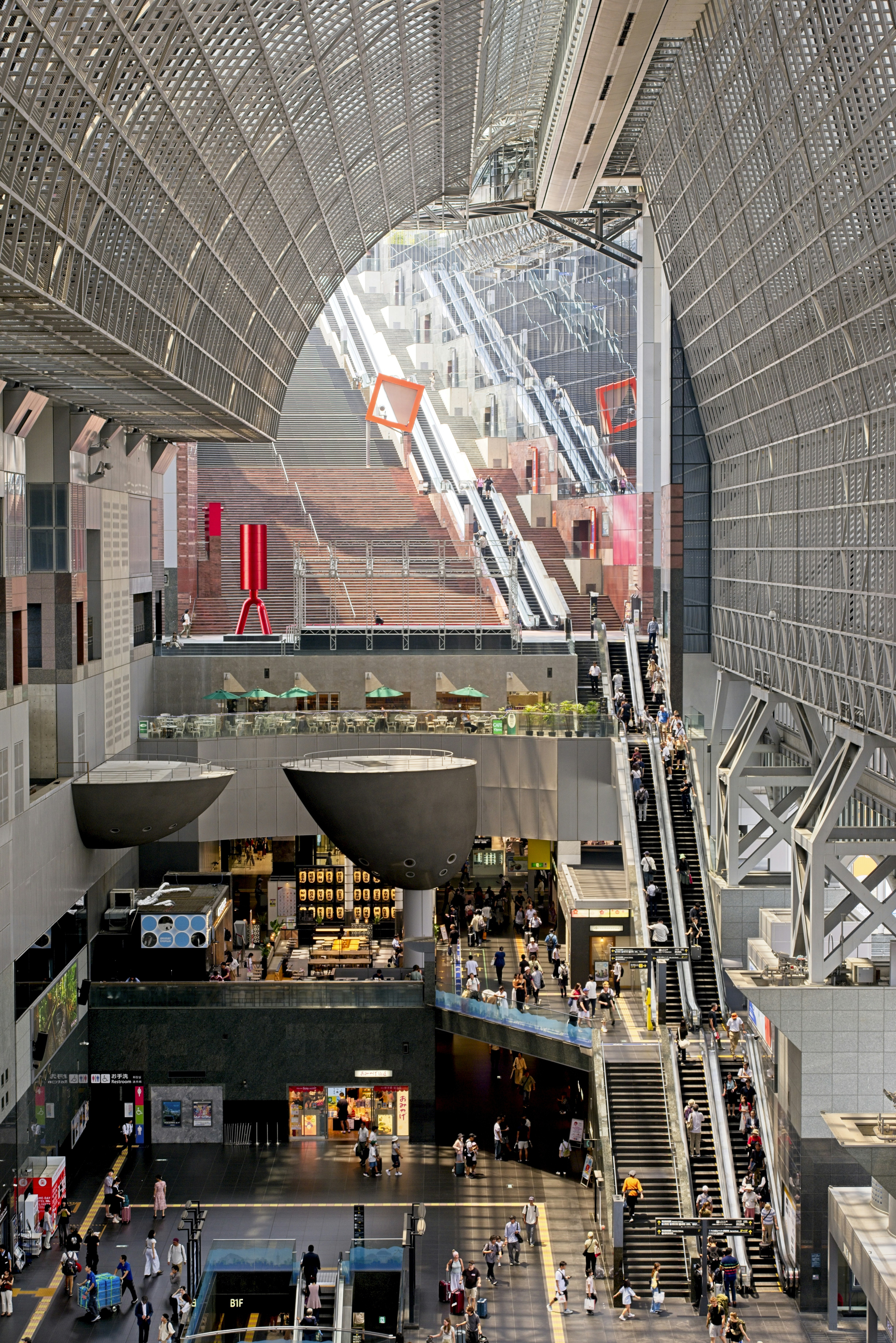 Sunlit Atrium Overlook: People Currents in a Modern Transit Hall