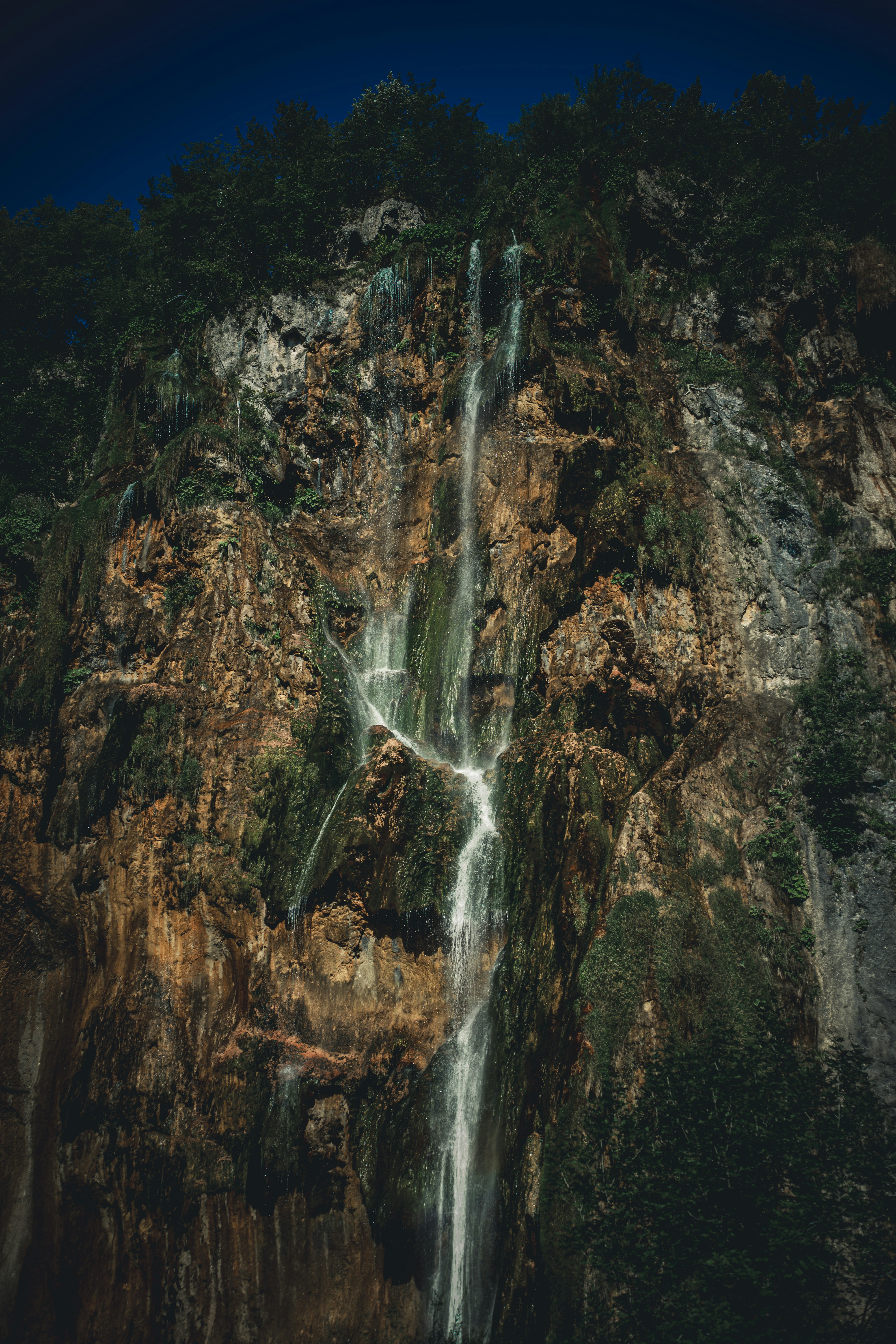 Vertical Veil: A Narrow Cascade Carved in Rock
