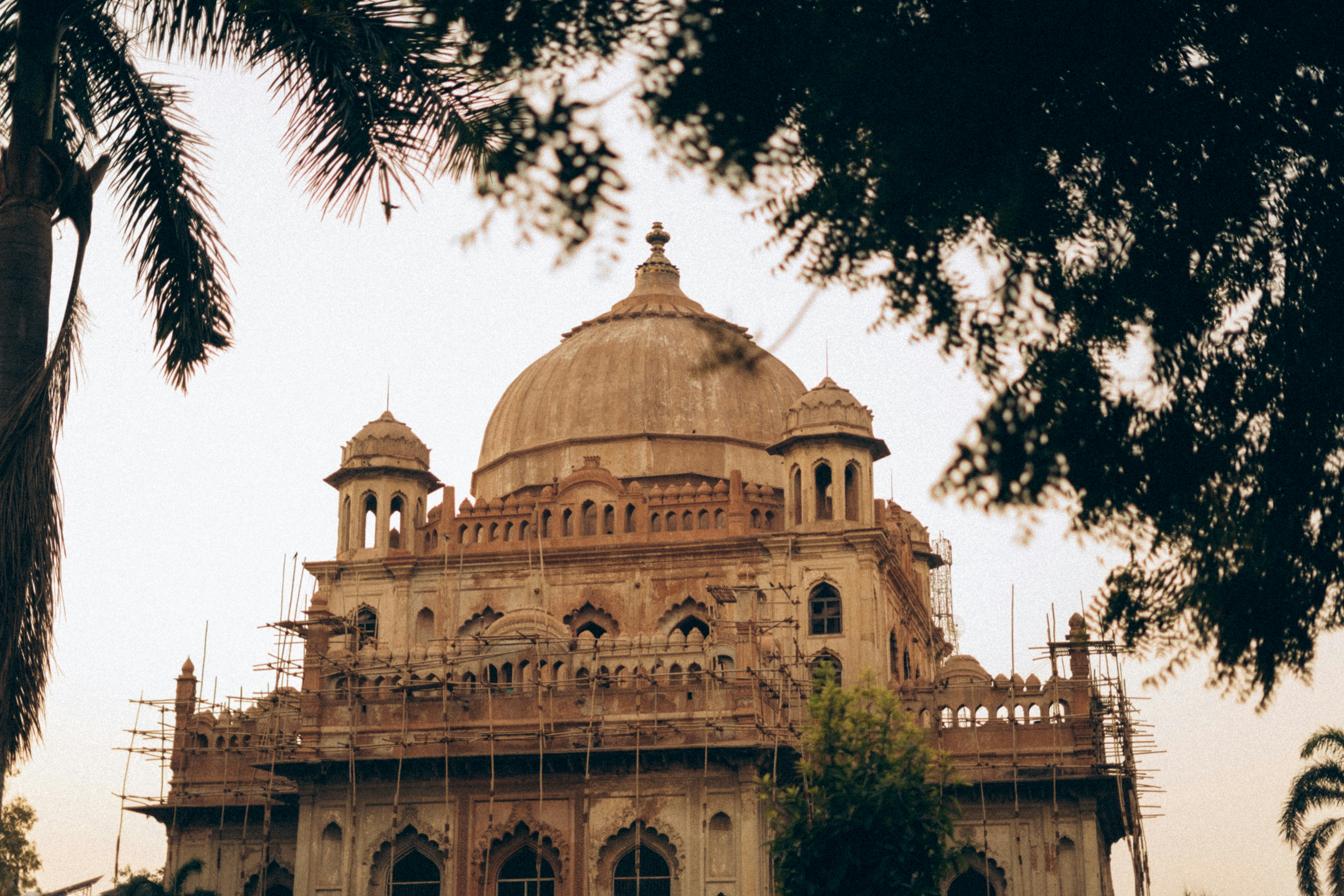 Domed Monument Rising from Shadowed Arcade