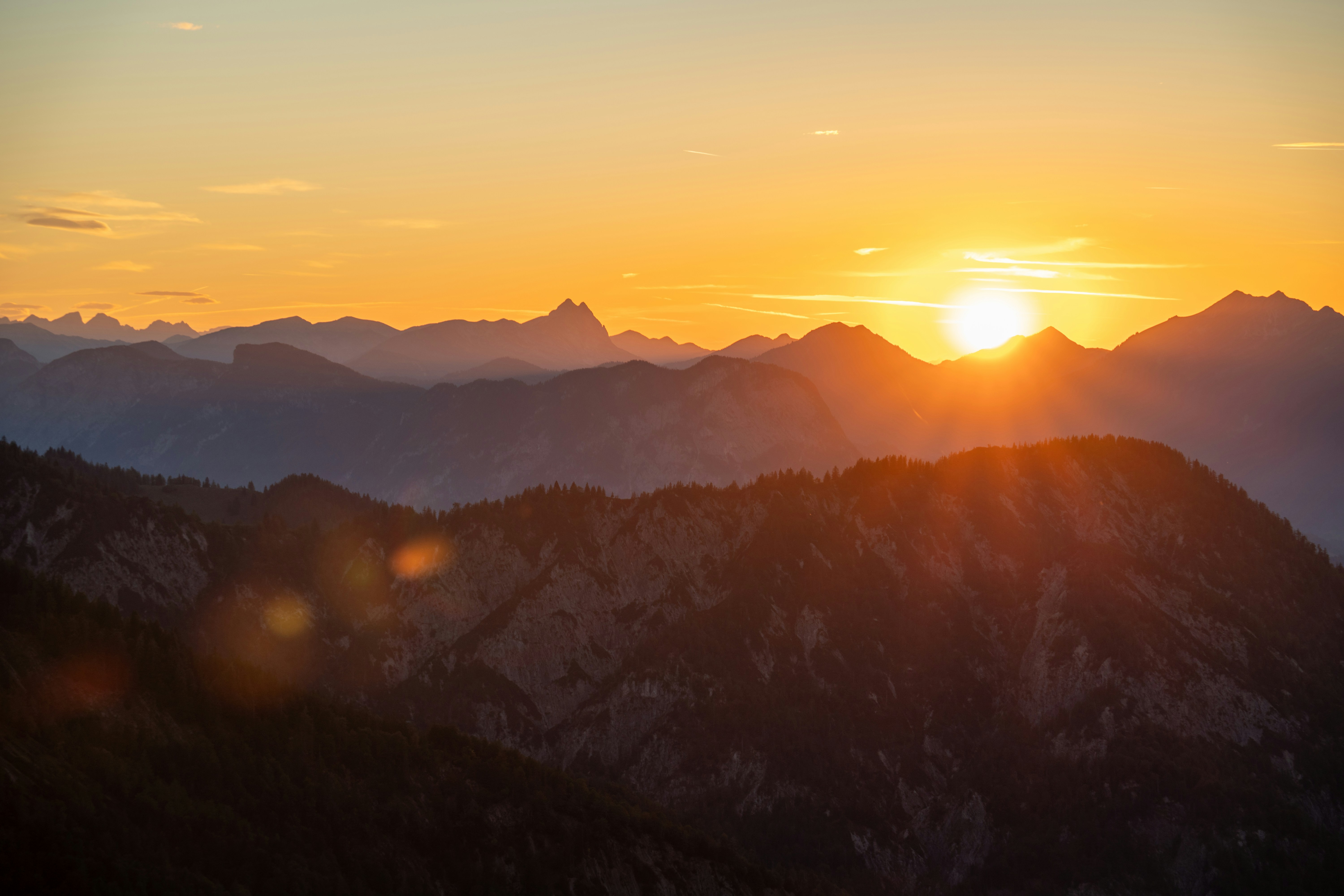 Sunlit Crest: A Panoramic Evening Over Alpine Ridges