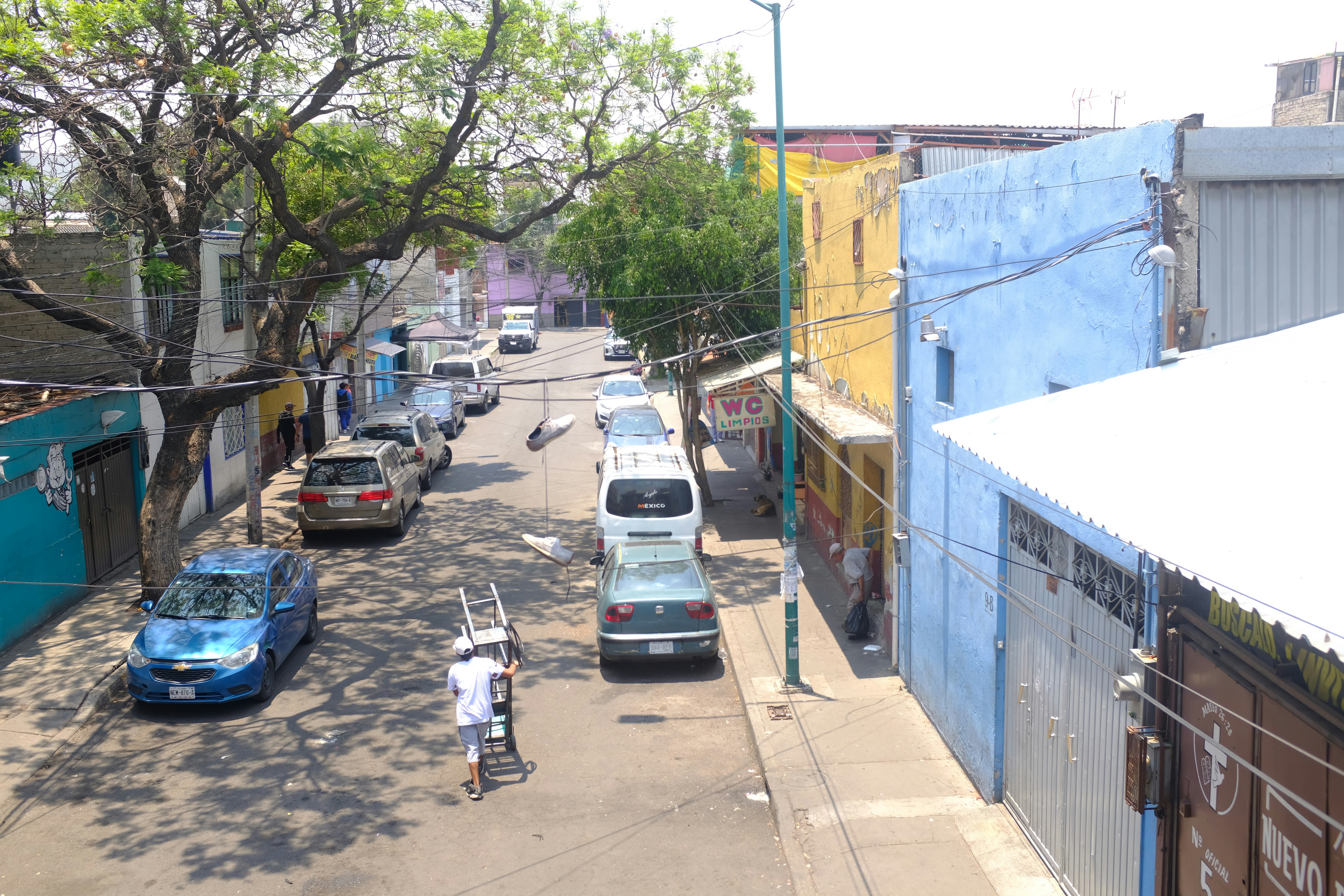 Streetside Labor and Color: A Quiet Urban Midday Walk
