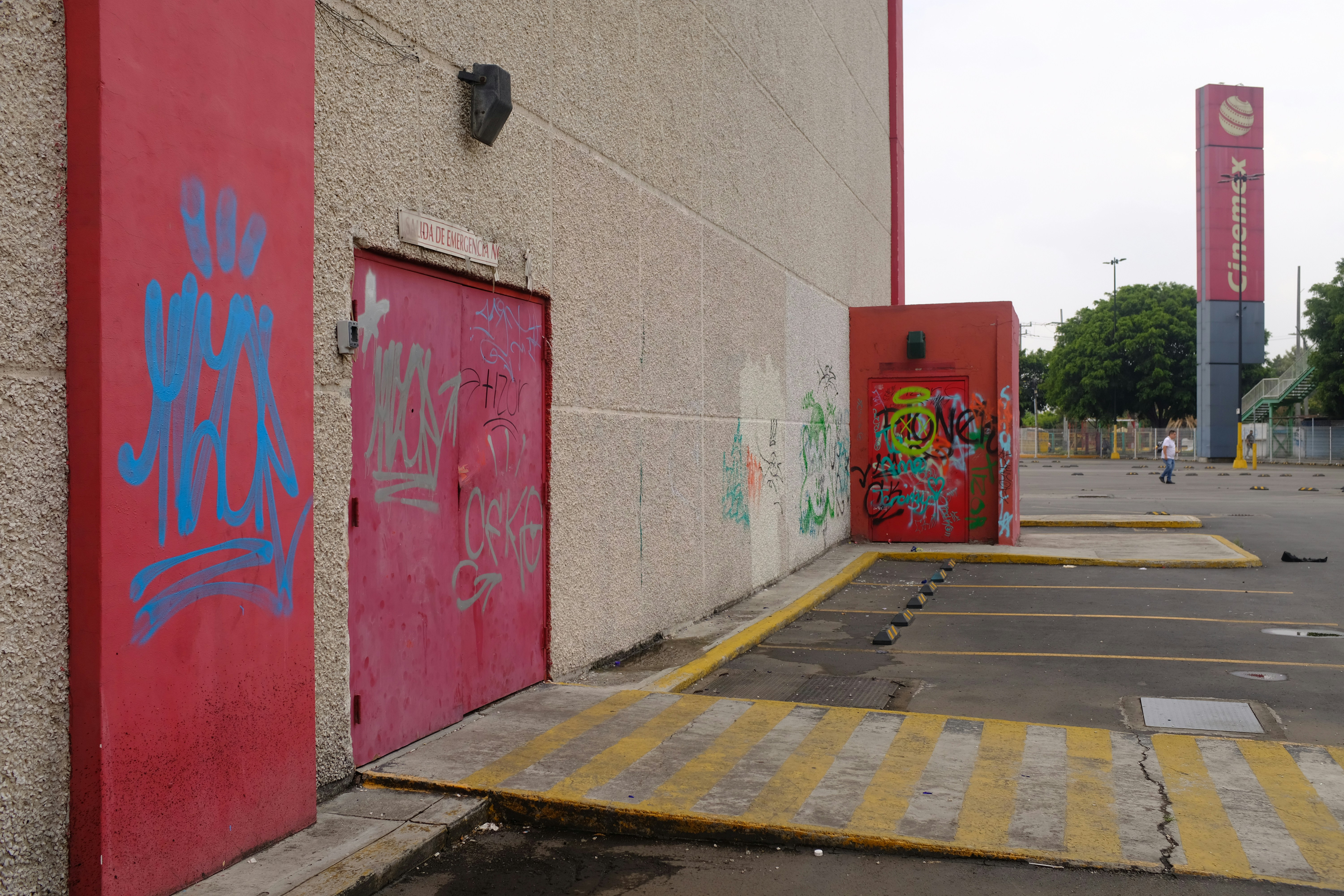 Chrome Gateways: Yellow Curb Lines Meet Graffiti Doors