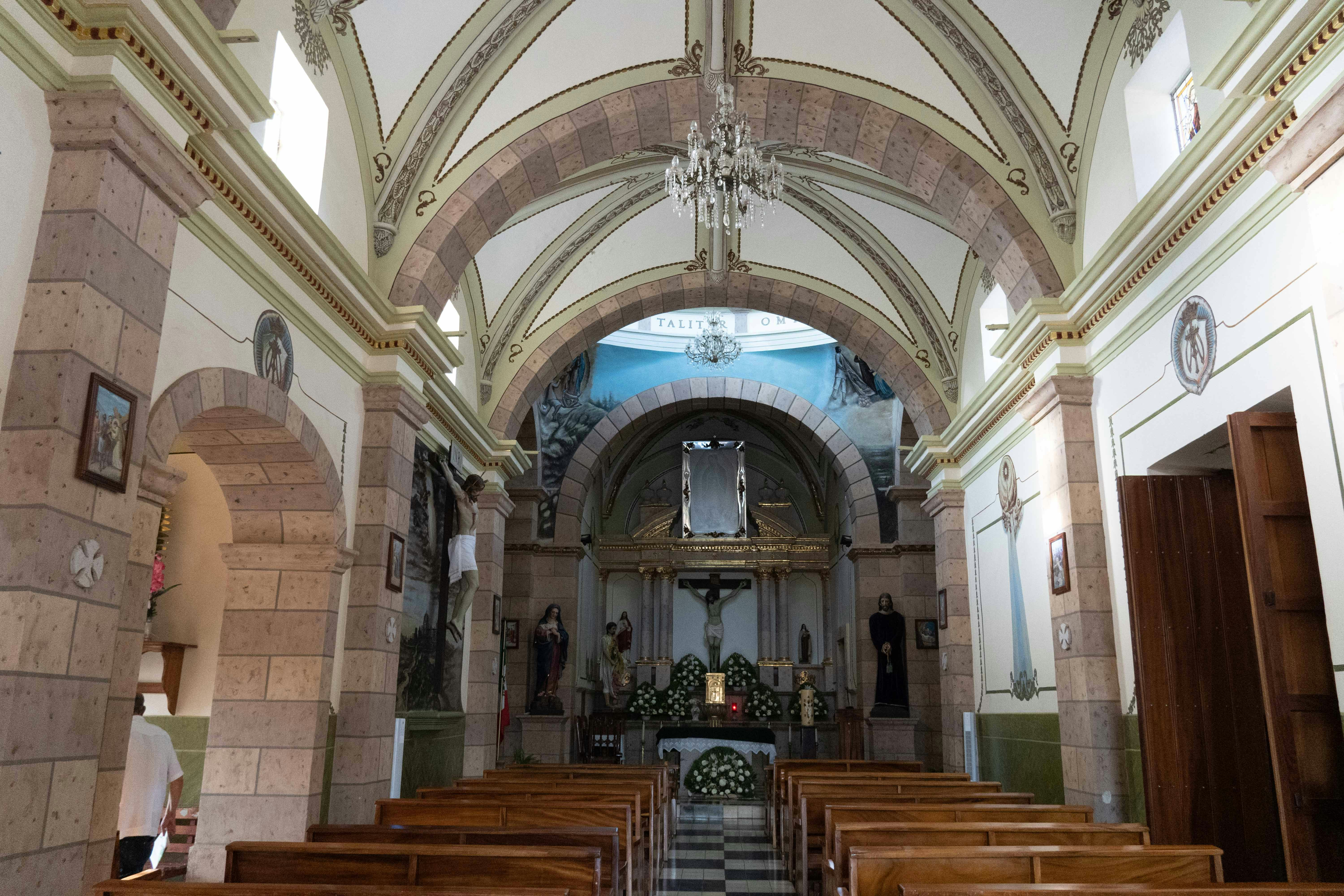 Sanctuary Arches: A Quiet Nave Leading to the Altarpiece