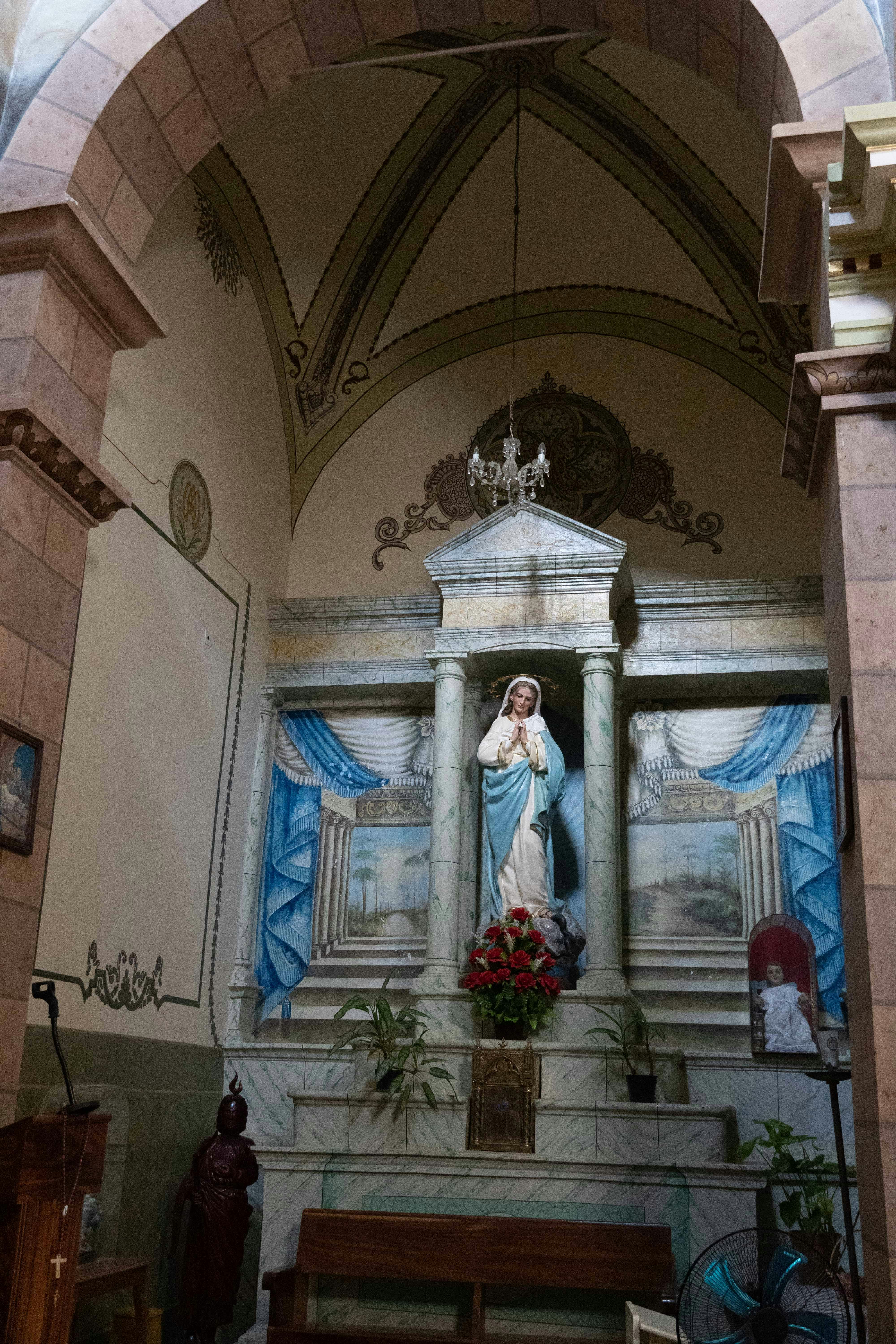 Reliquary Light: Virgin Statue Beneath the Arch