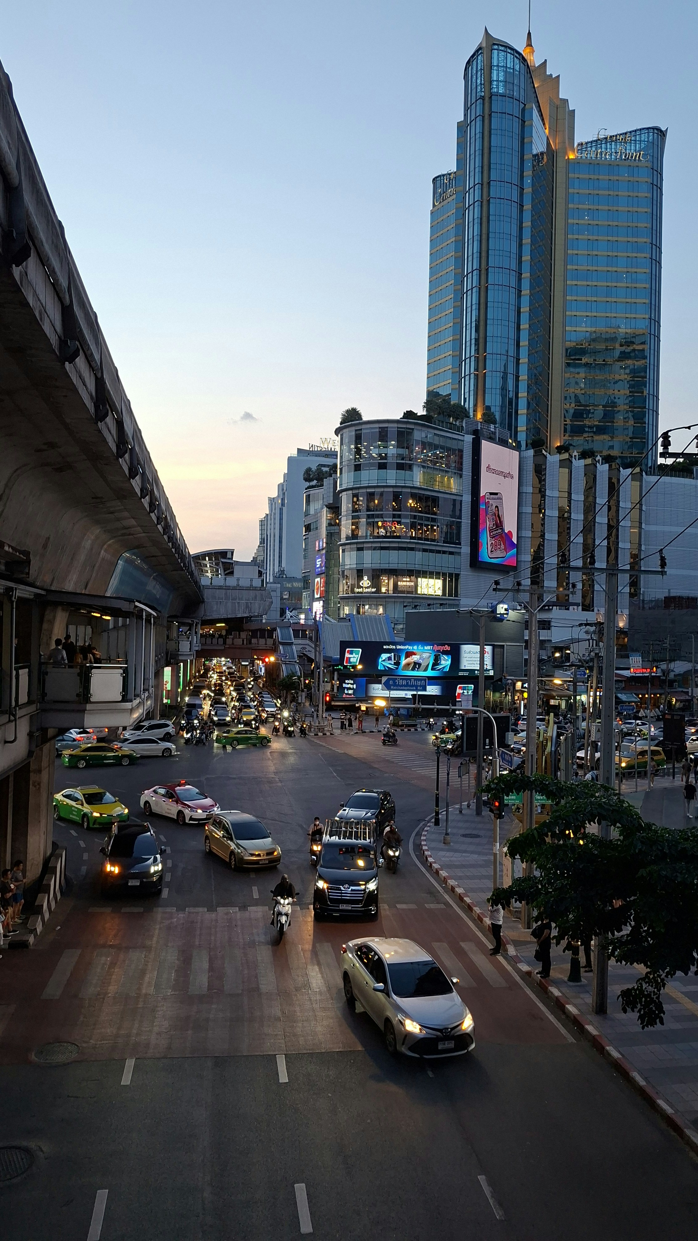 City at Dusk: Street Scene Beneath Skyscrapers