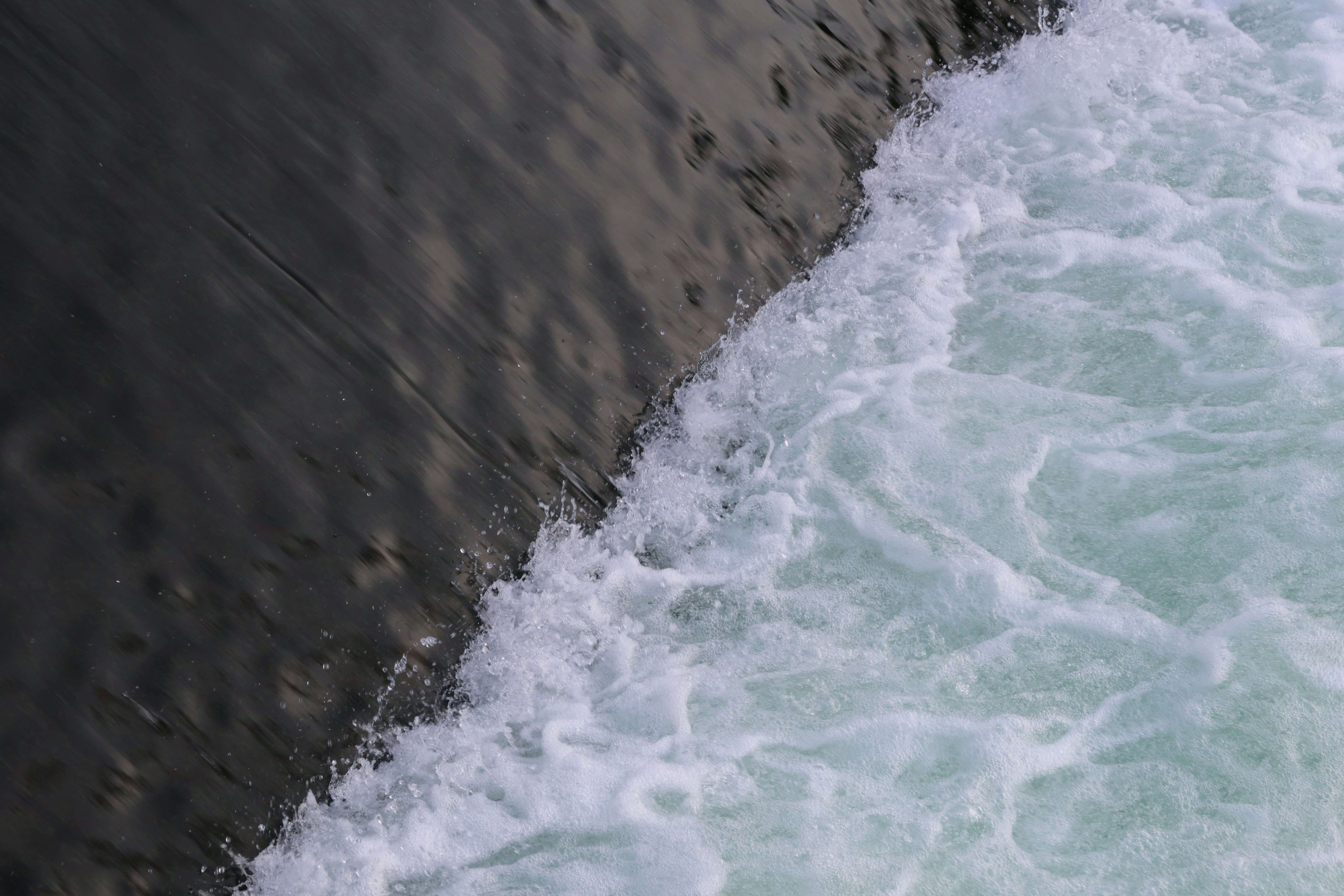 Edge of Foam: A Quiet Boundary Where Water Meets Dark Shore