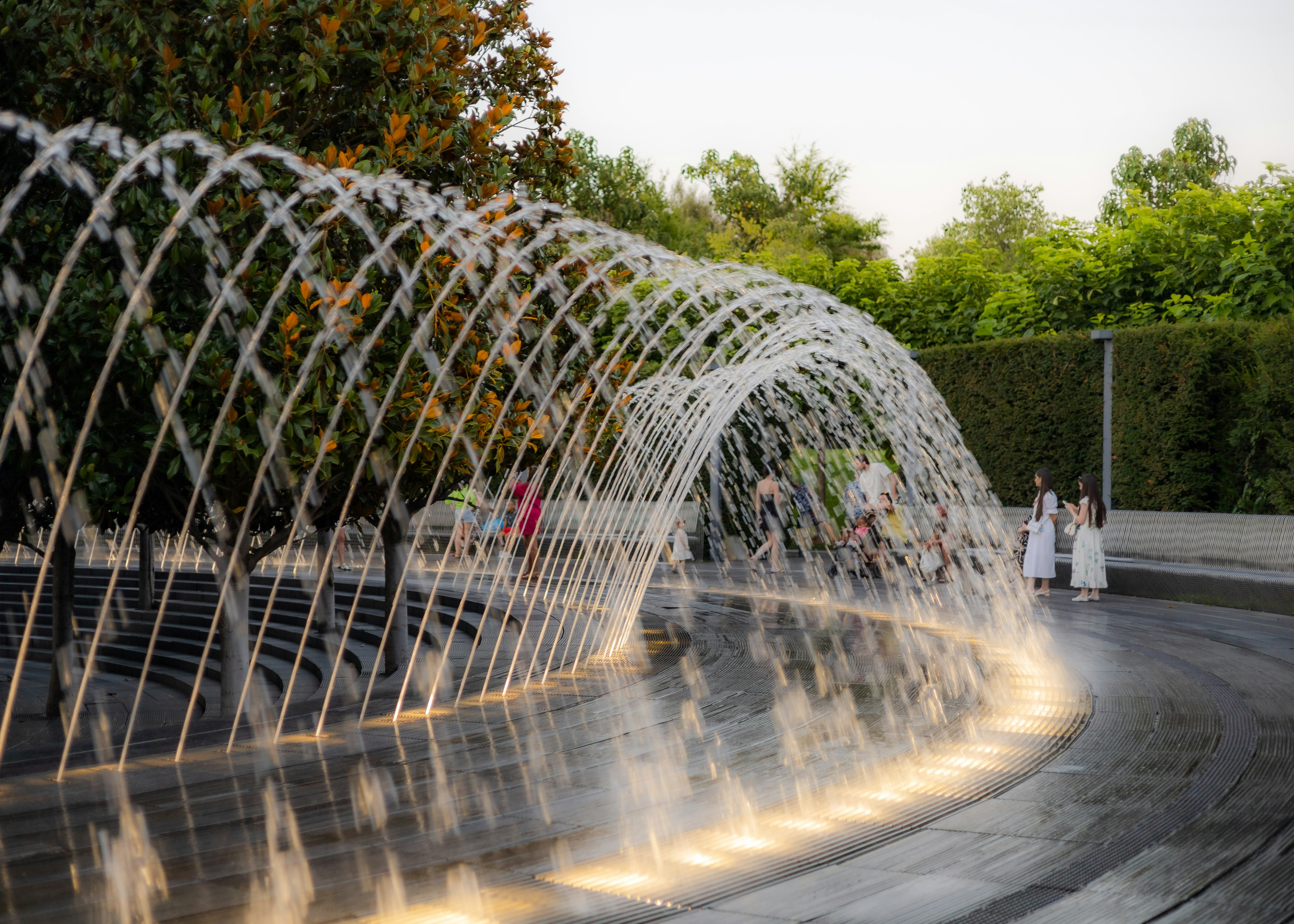 Curved Jet of Light: A Quiet Evening by the Fountain
