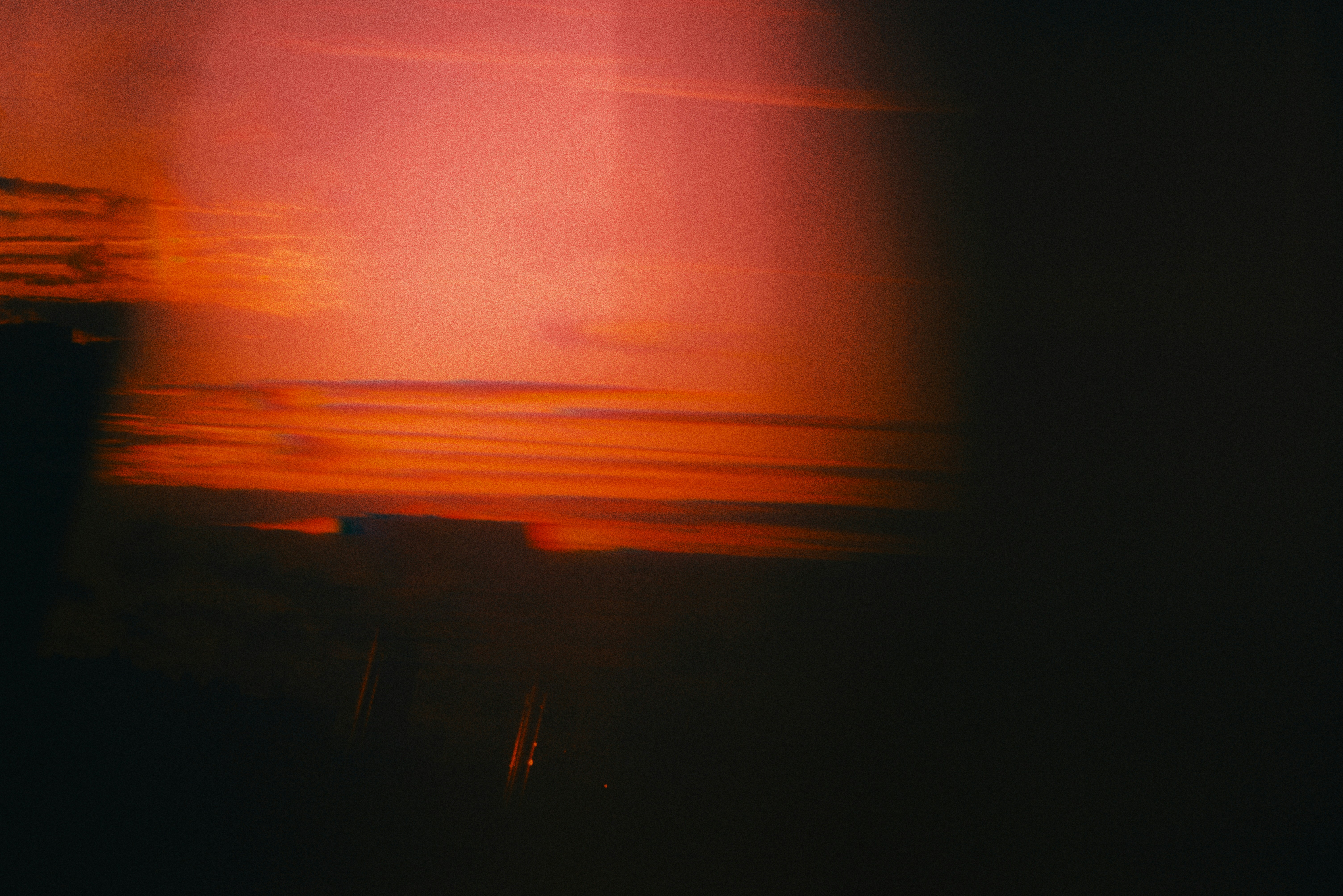 Midnight Ember: A Glimpse of Fiery Horizon Through a Veil of Lens