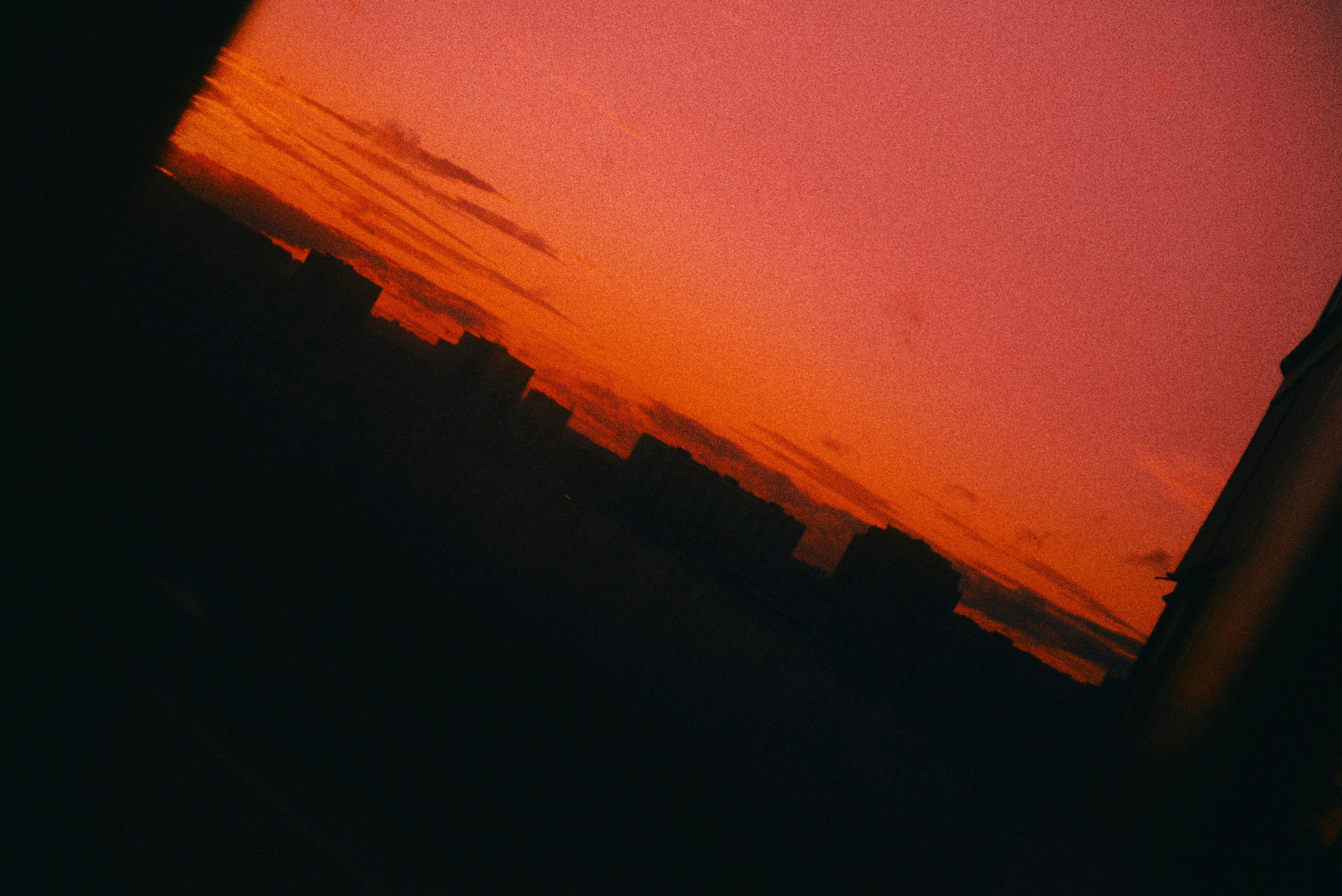 Crimson Skyline over a Quiet City