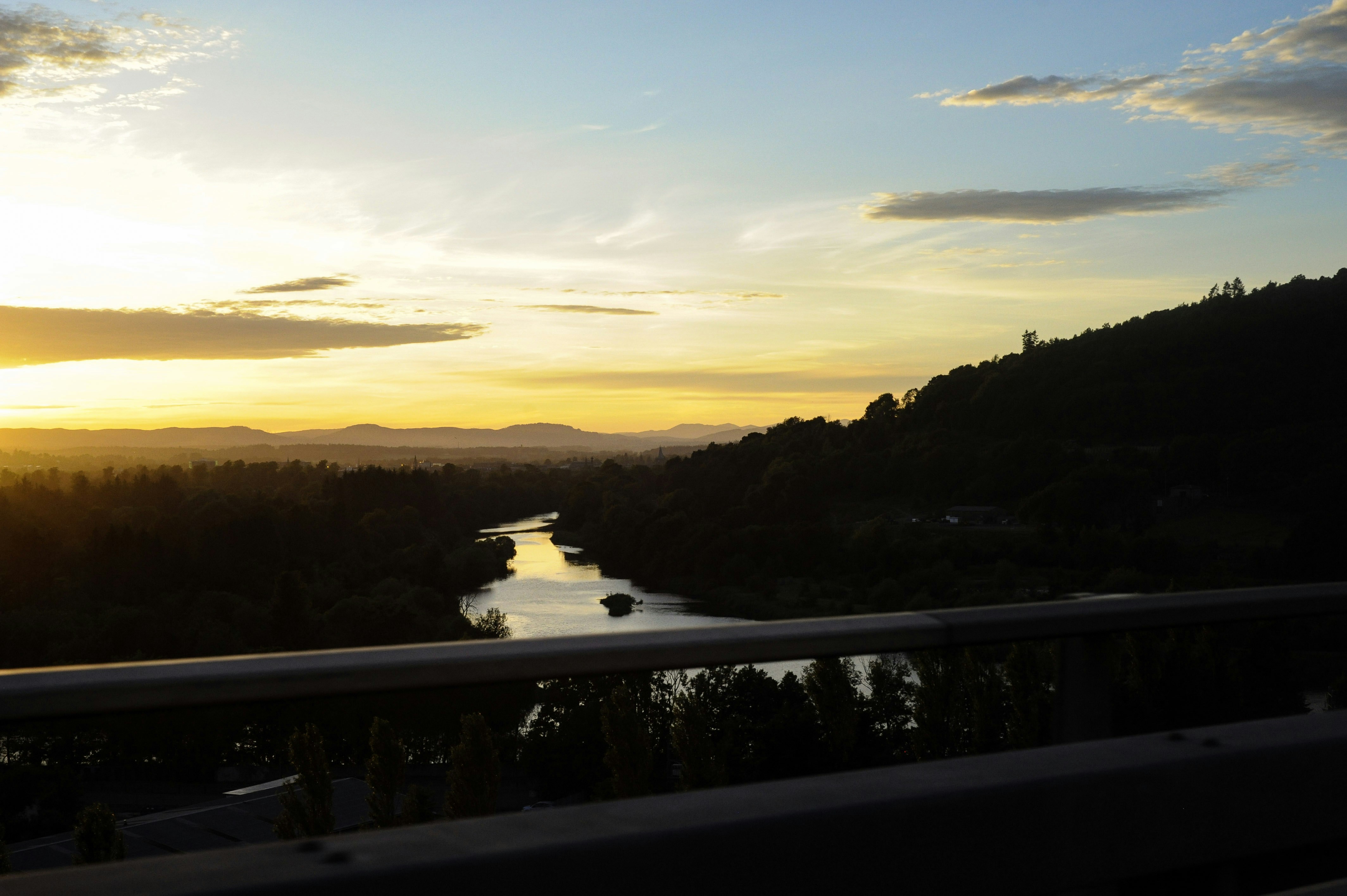 Dusk on the River Road: Sunset Over the Valley