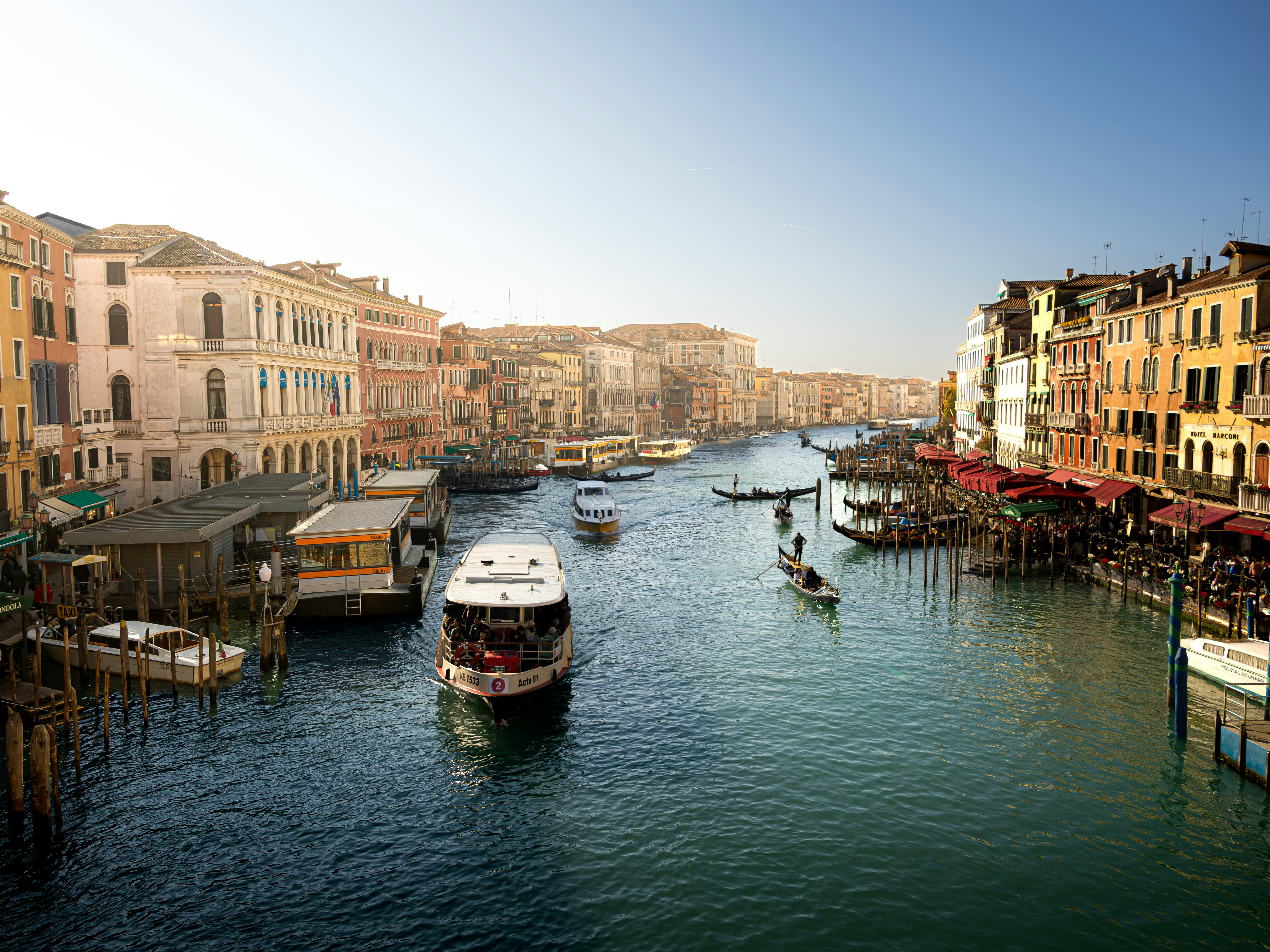 Vibrant Grand Canal Corridor: Boats, Buildings and Sunlit Water