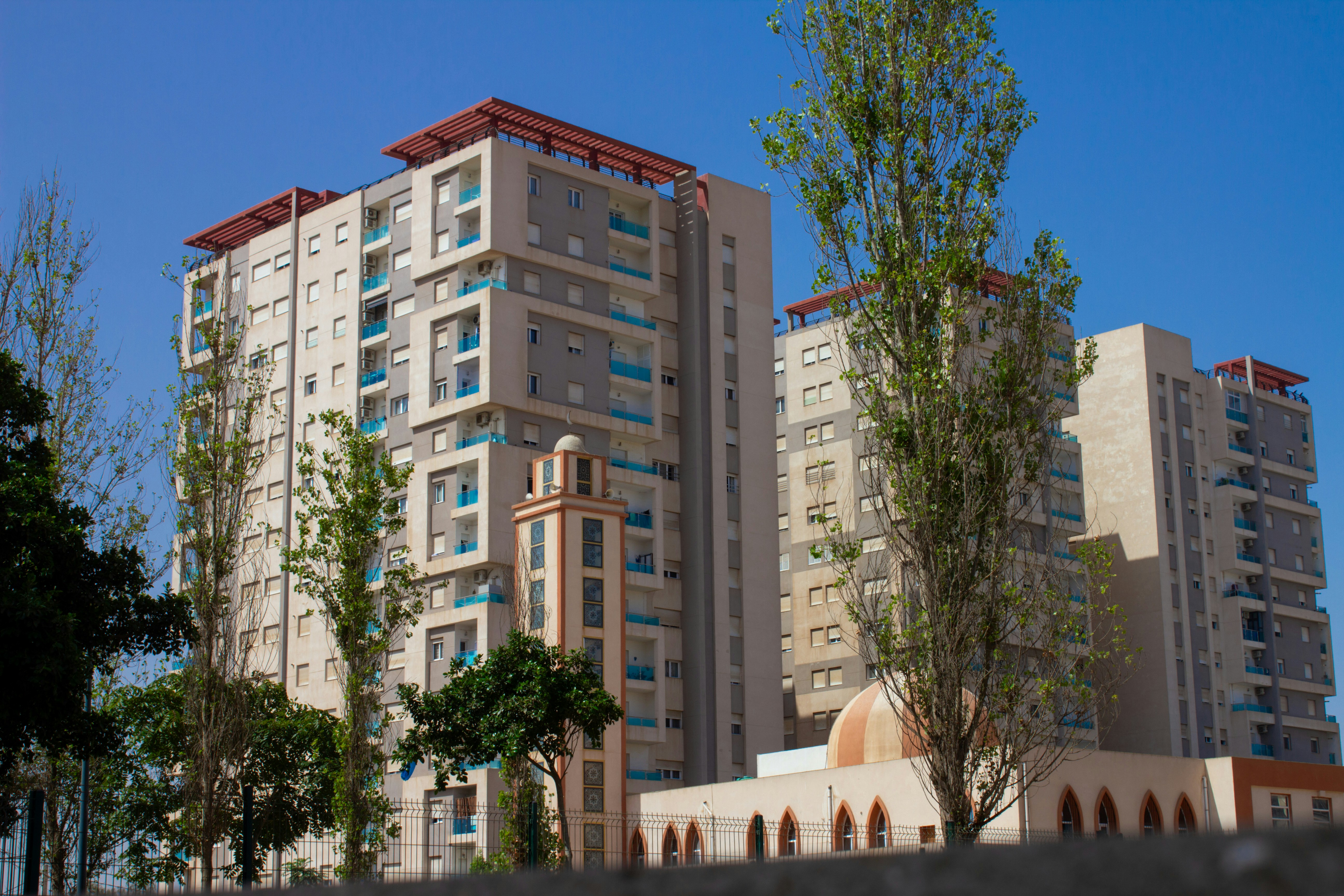 Vertical Campus Towers Against a Clear Blue Sky